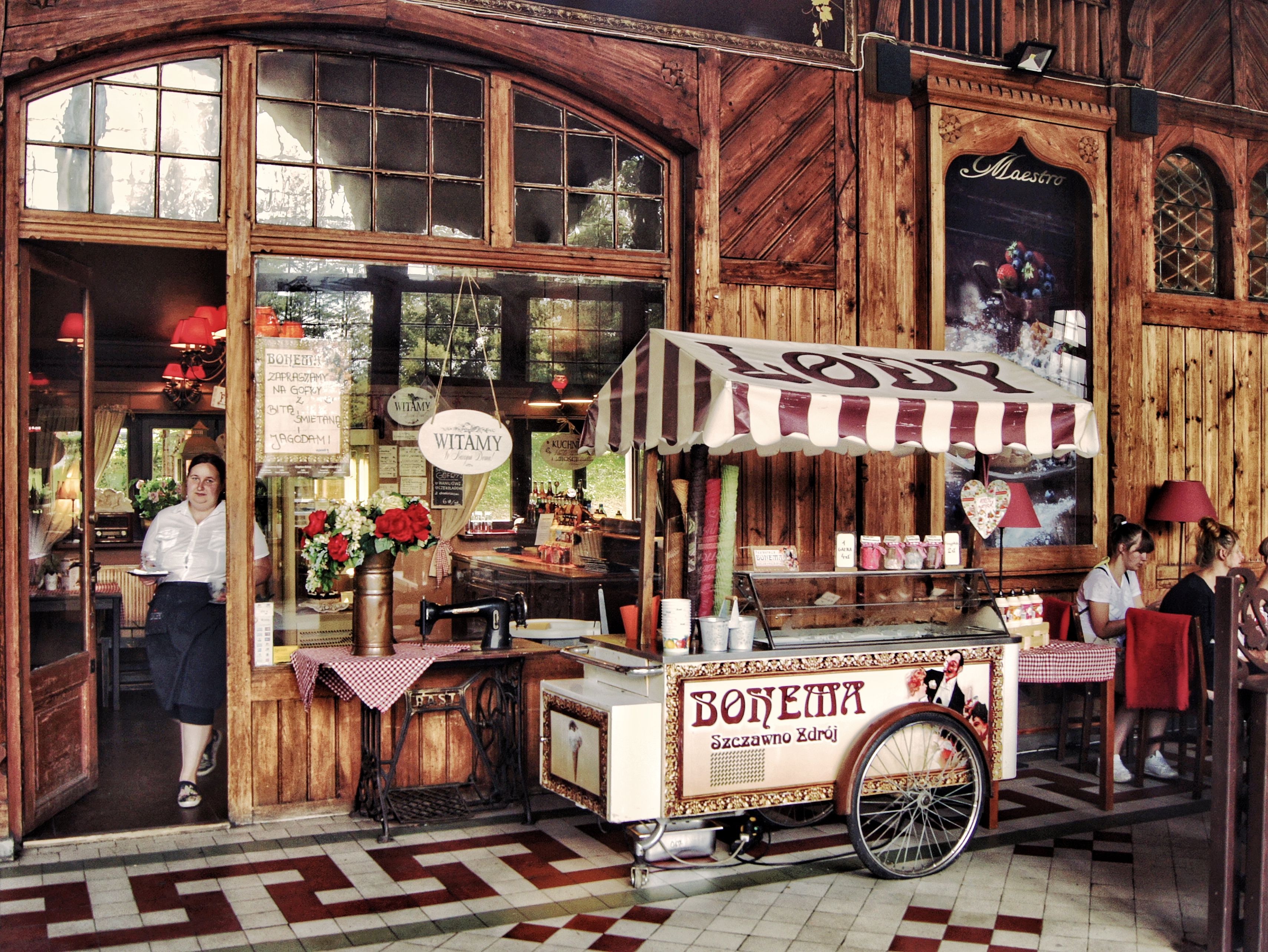 A Food Cart in Front of a Shop Display Window · Free Stock Photo