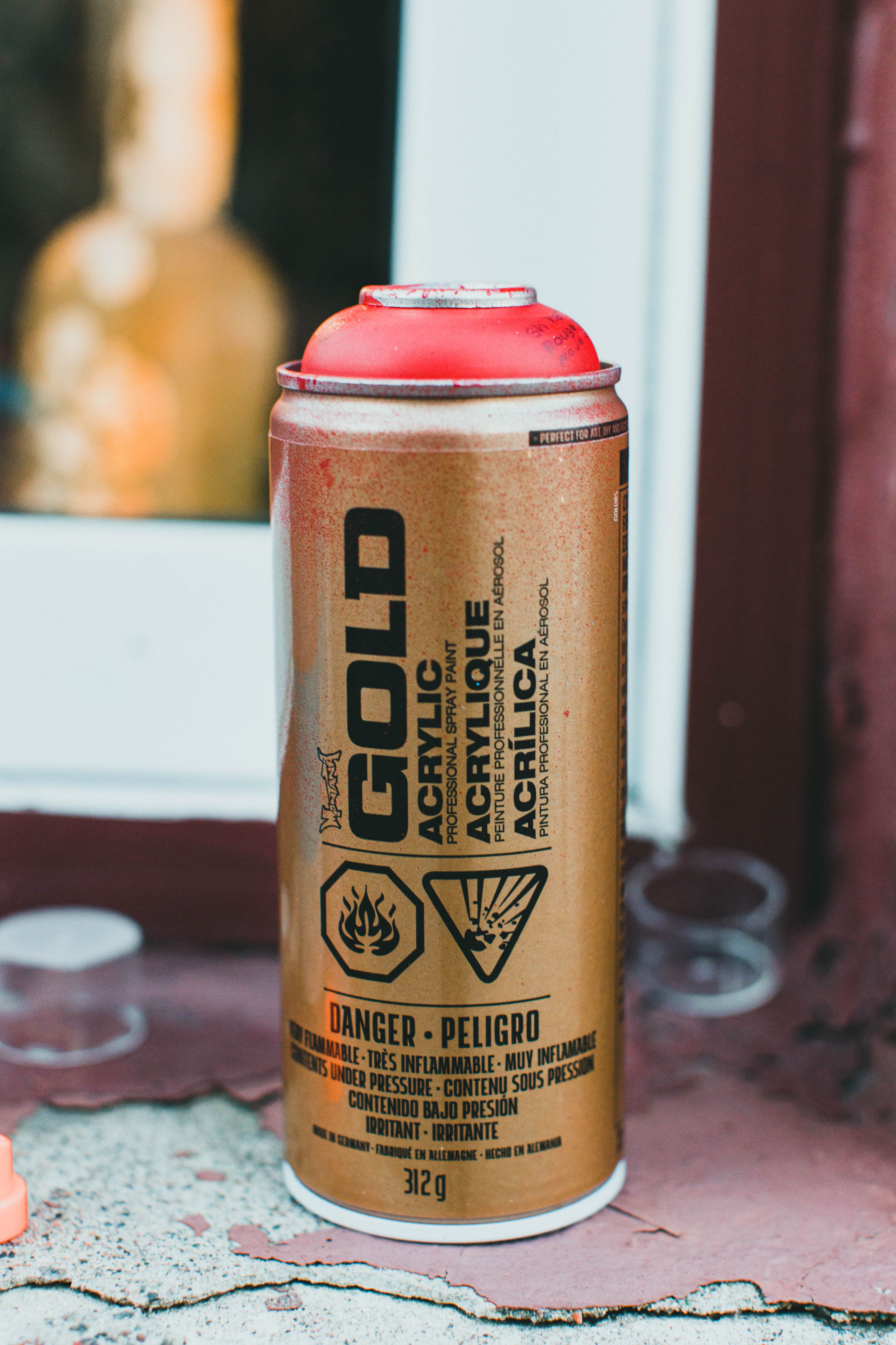 Close-Up Photo of a Man Holding a Black Spray Can · Free Stock Photo