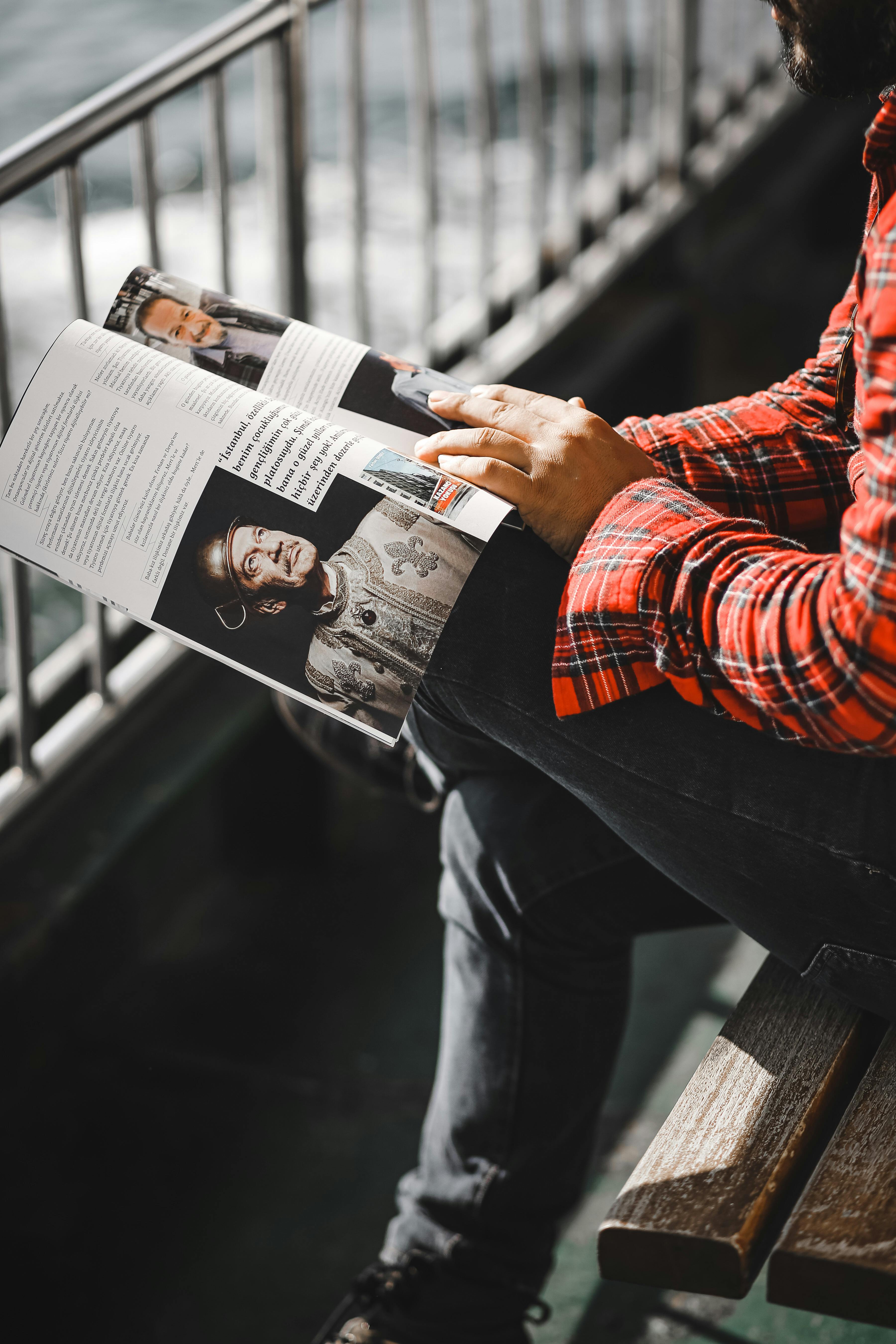 A Person Reading a Magazine · Free Stock Photo