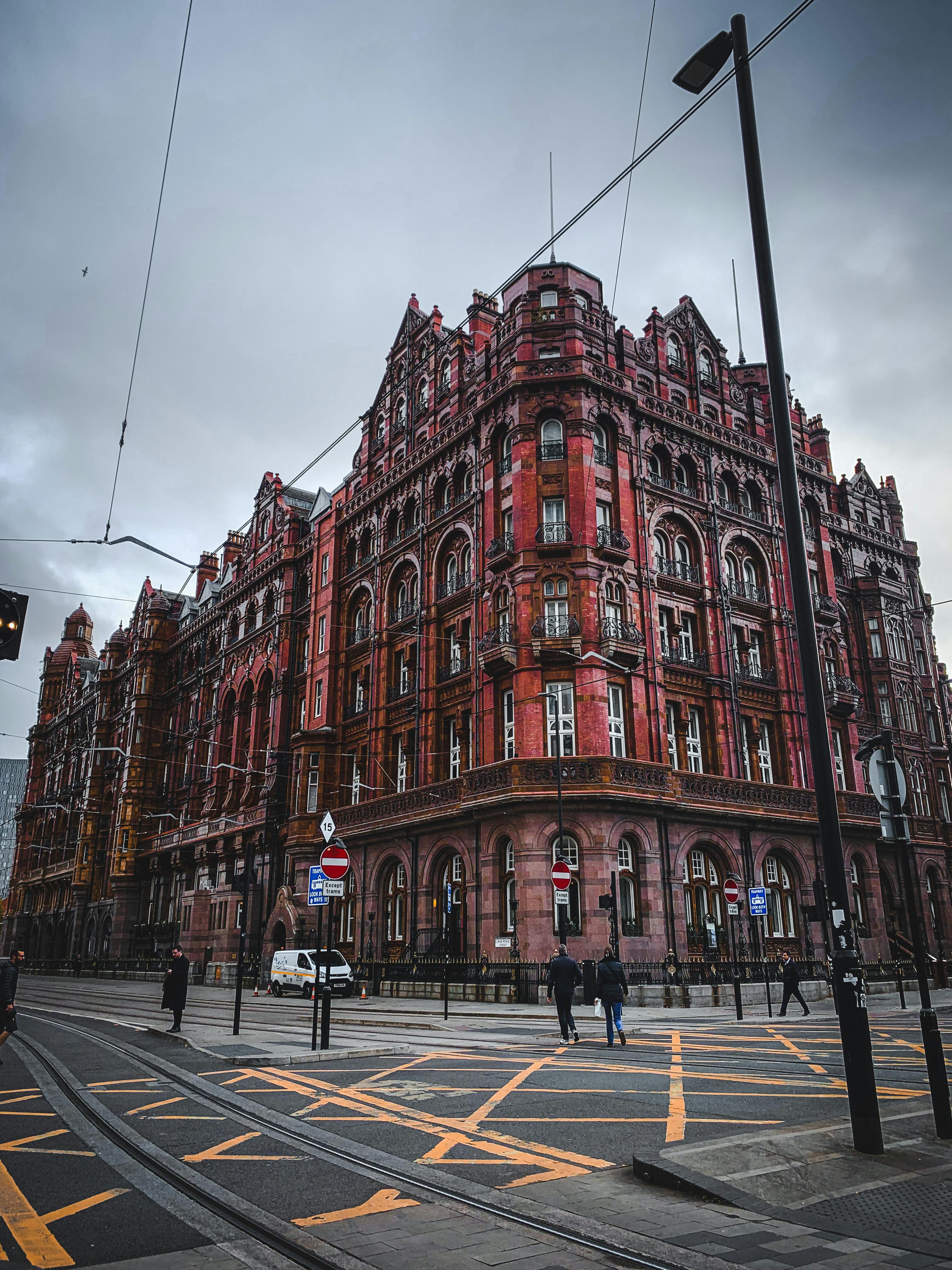 A Biker Crossing a Road Intersection · Free Stock Photo