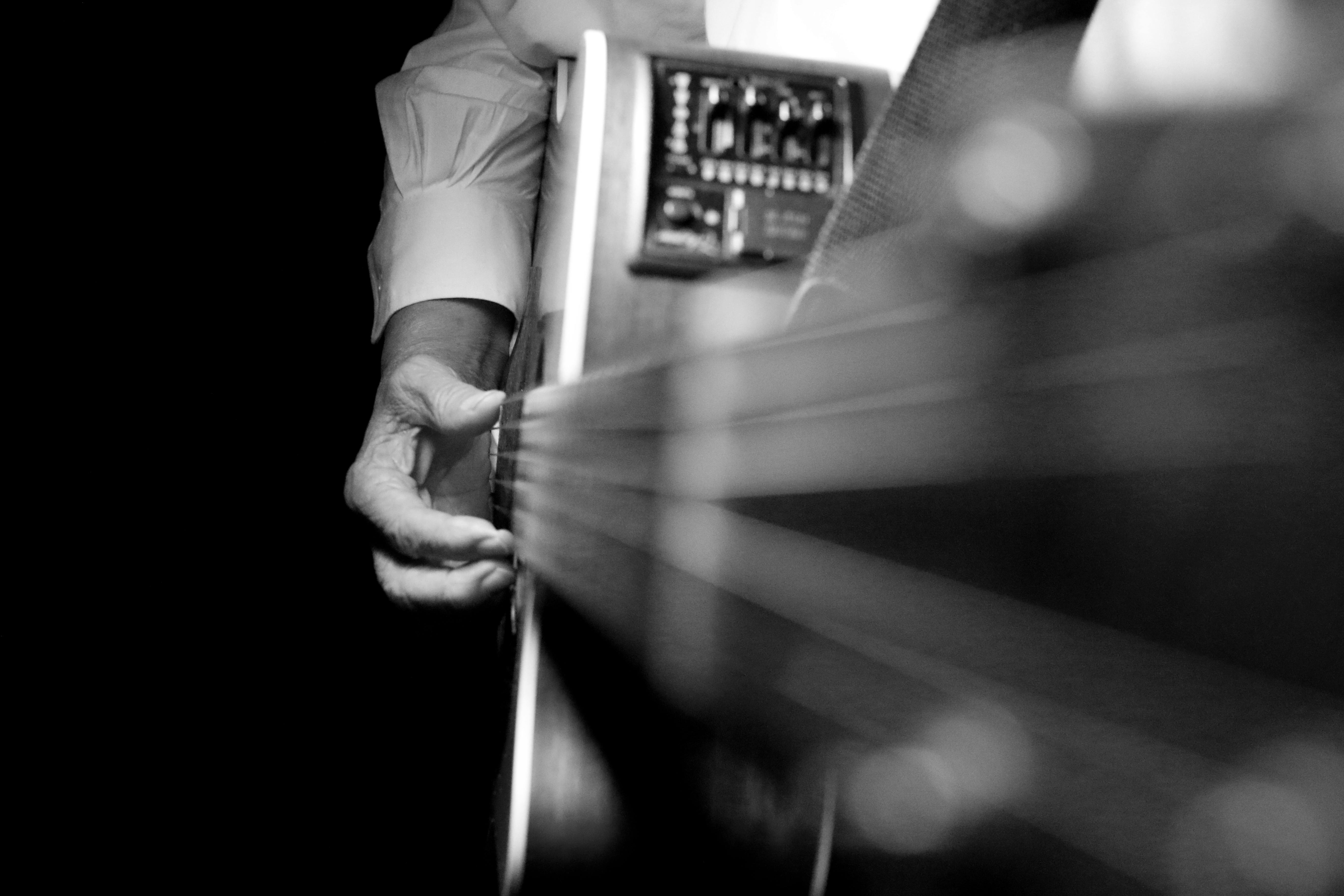 Person Holding an Acoustic Guitar · Free Stock Photo