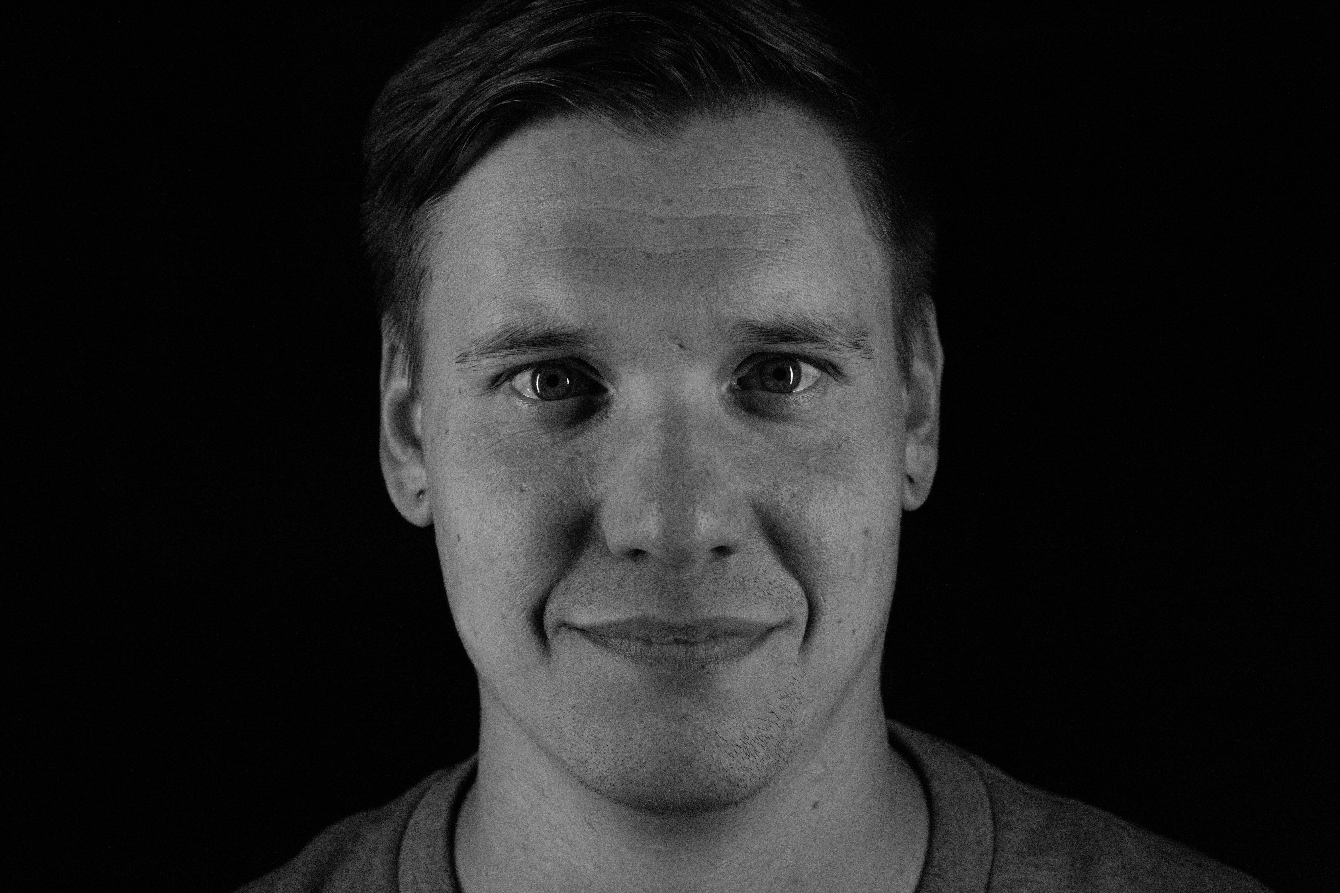 Grayscale Photo of Man Holding his Neck · Free Stock Photo