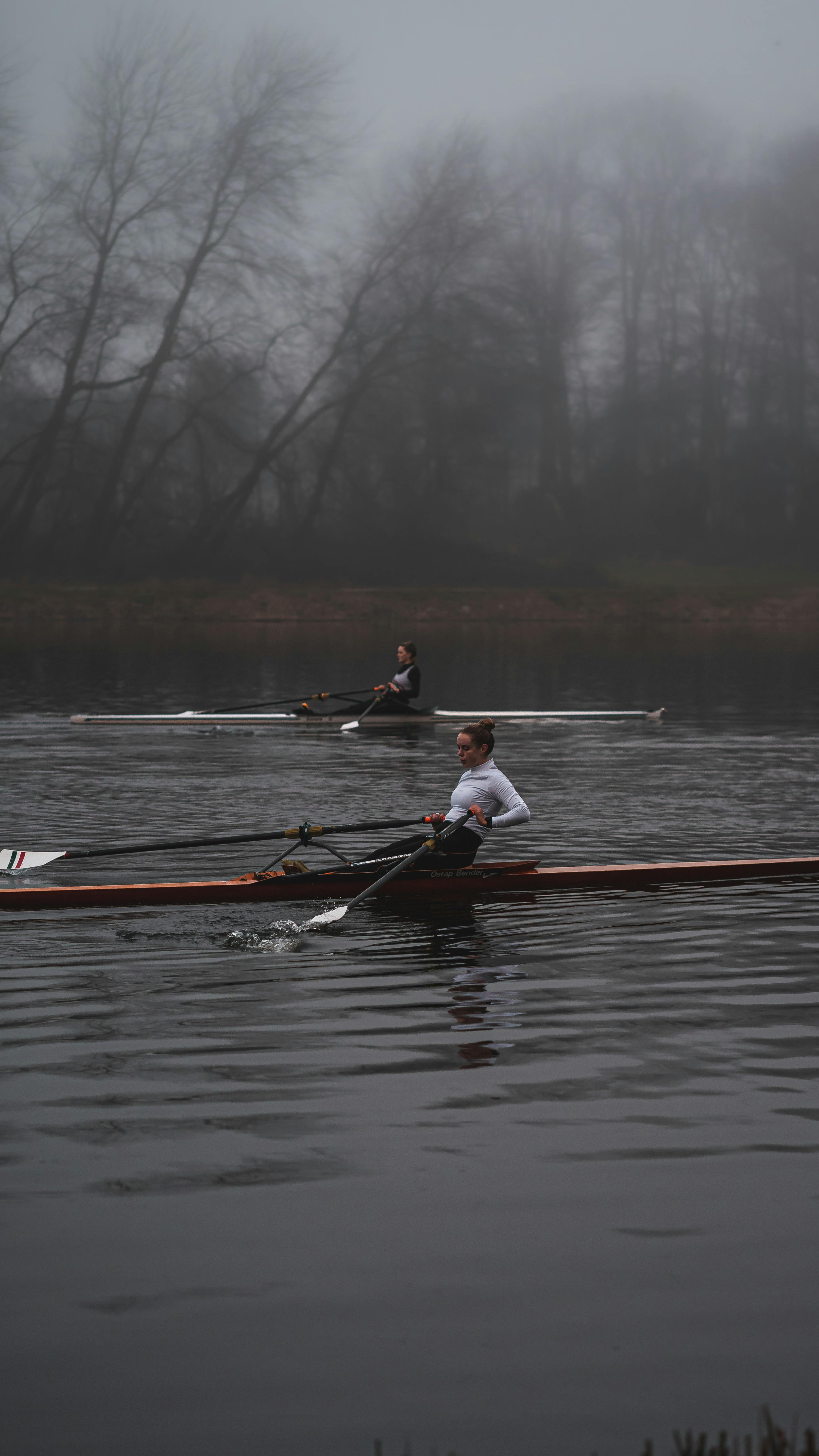 People Rowing on a Boat in the Lake Covered with Fog · Free Stock Photo