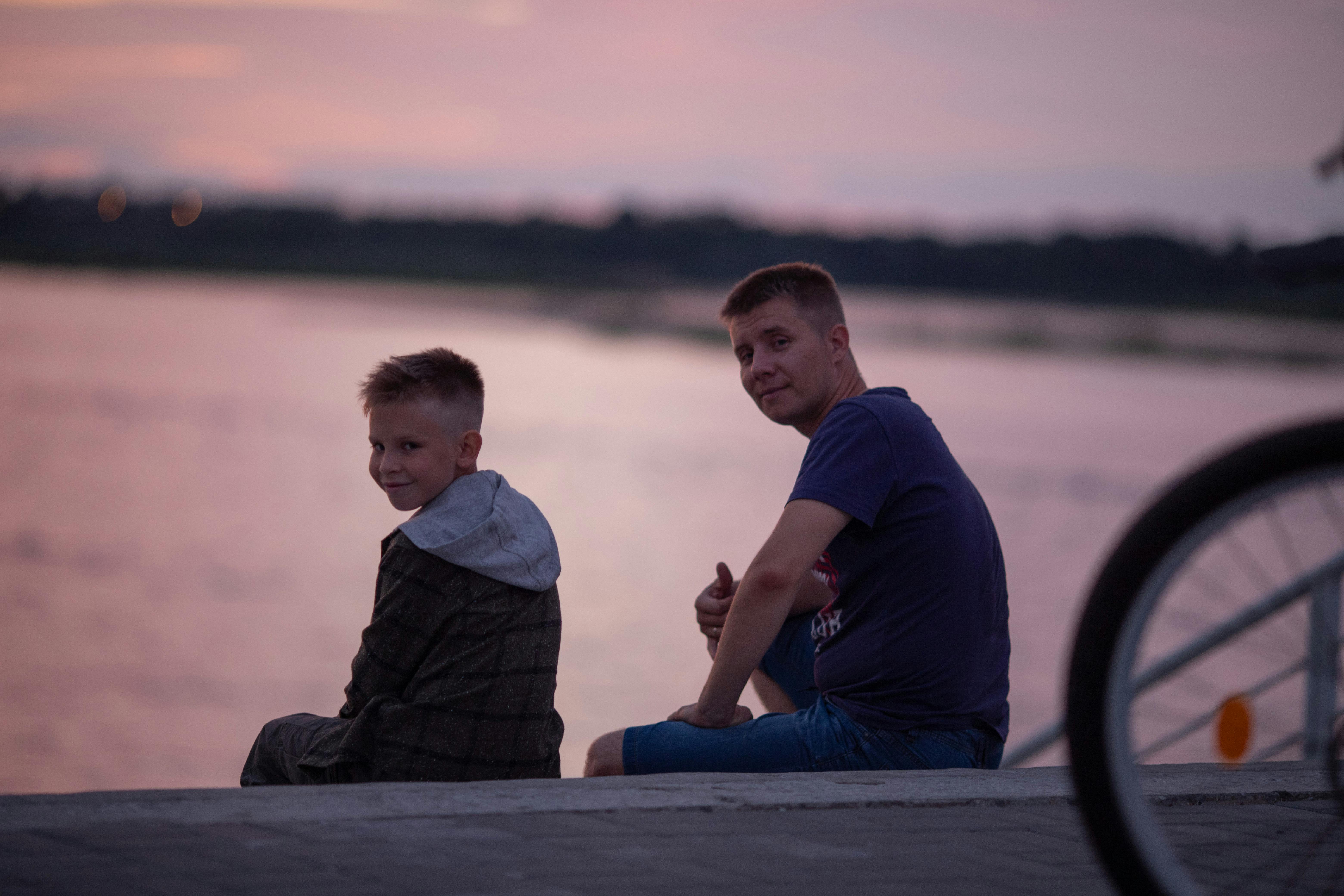 Man and a Boy Looking Back · Free Stock Photo