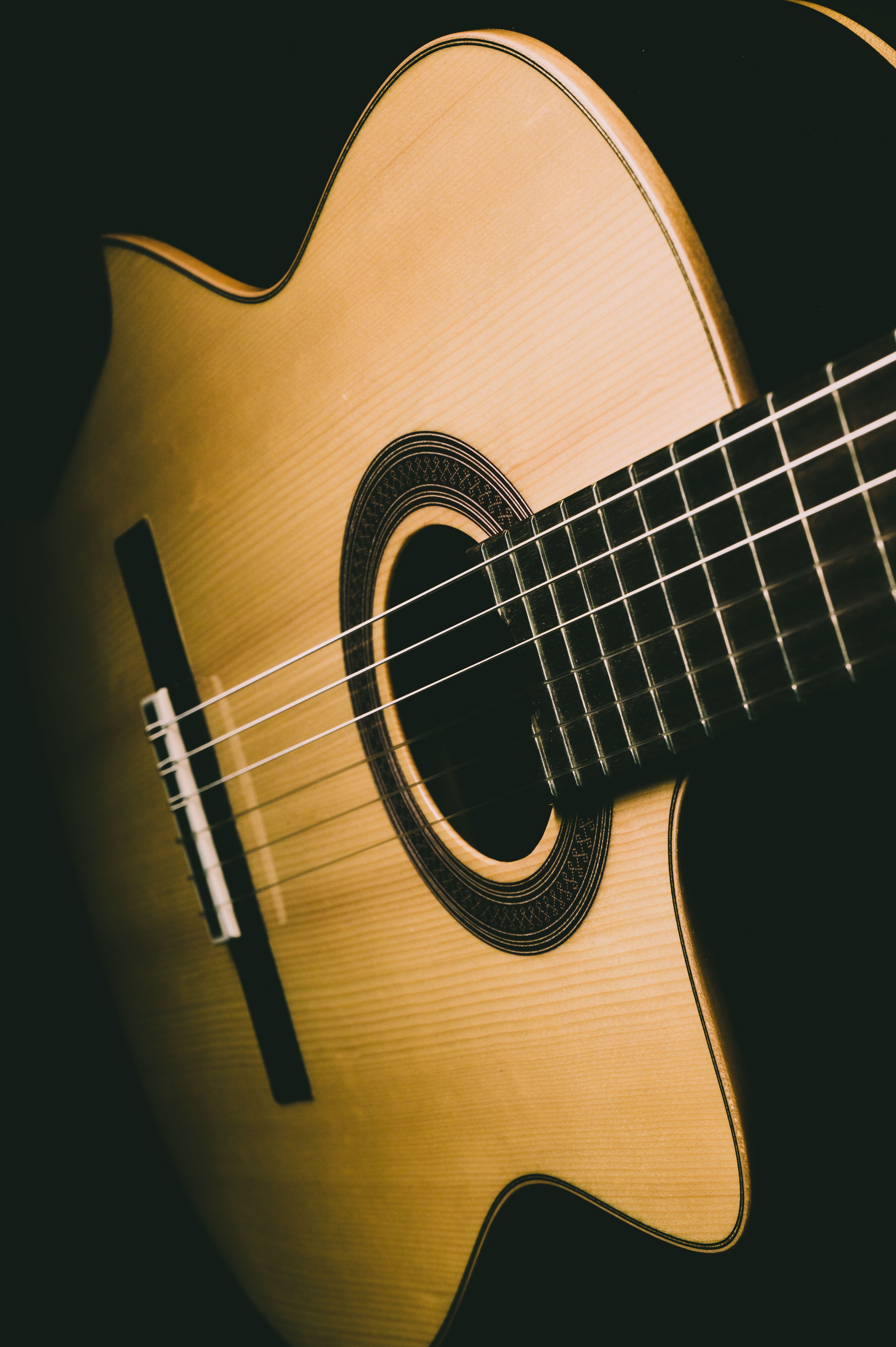 Close Up Photo of an Acoustic Guitar · Free Stock Photo