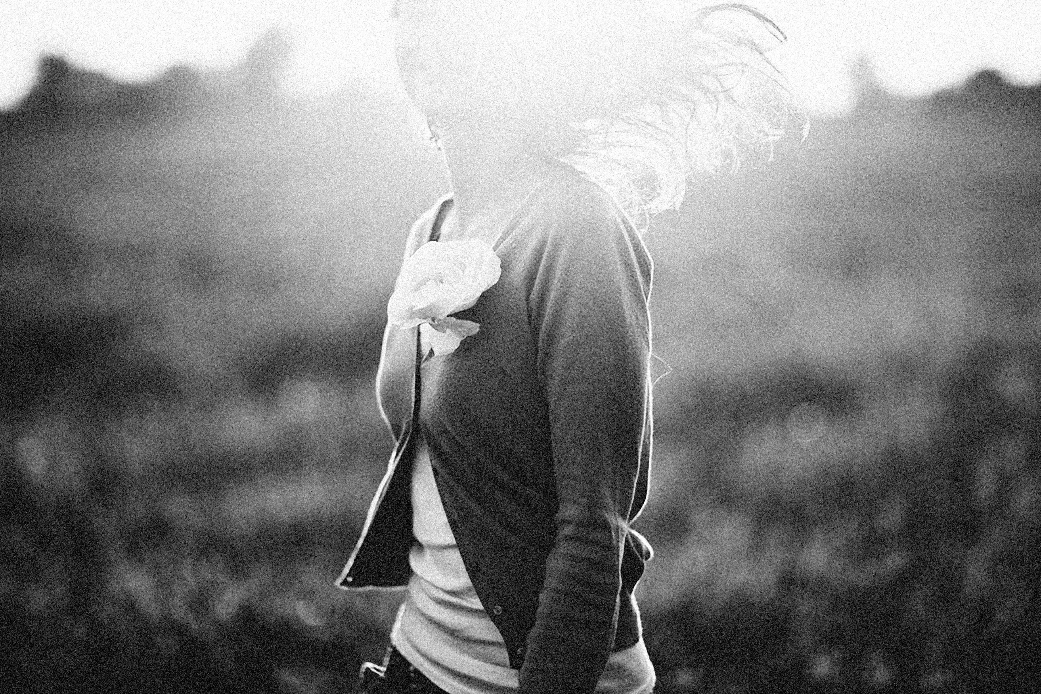 Grayscale Photo of Woman Running on Field · Free Stock Photo