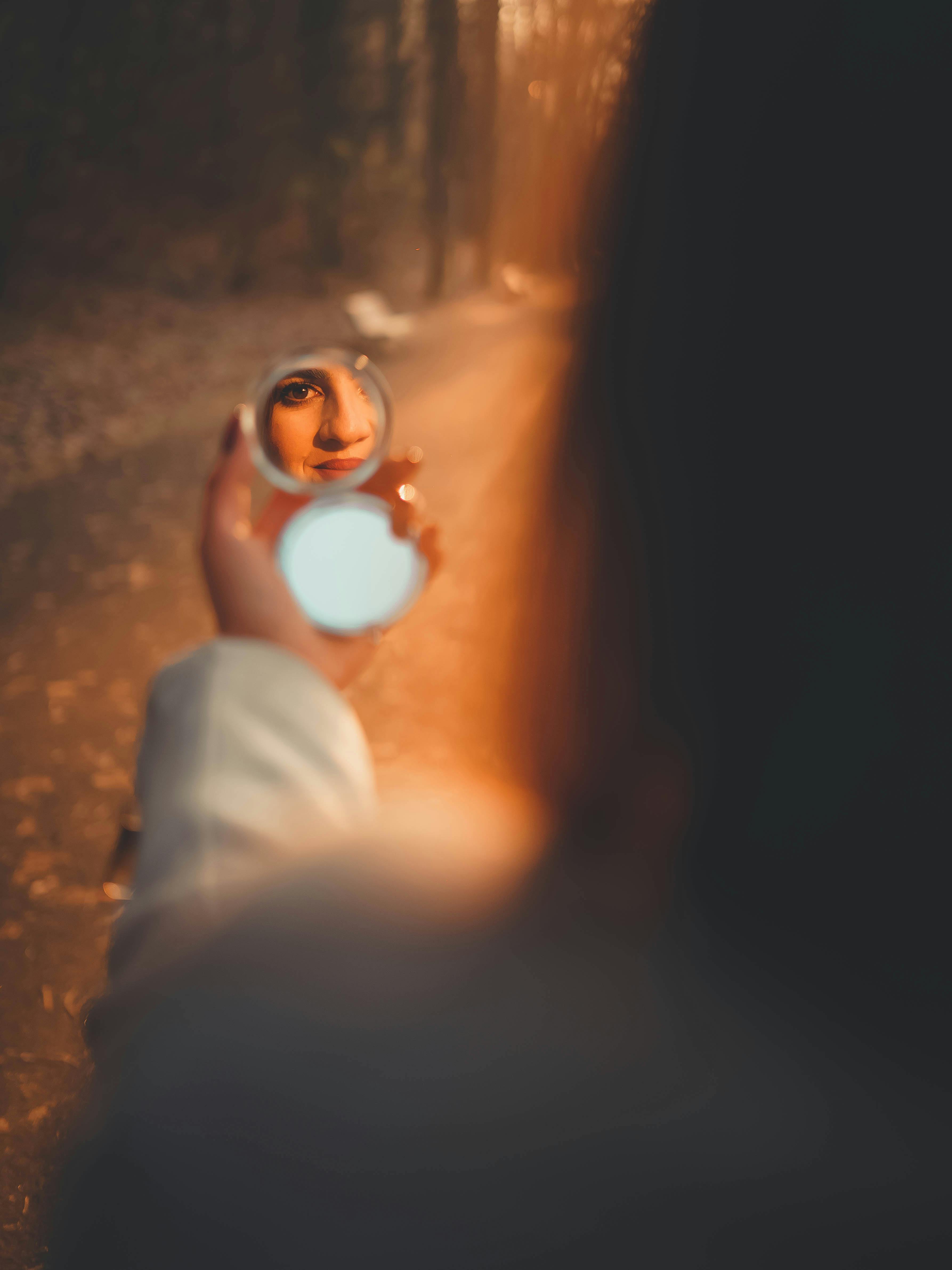 A Person holding a Mirror · Free Stock Photo