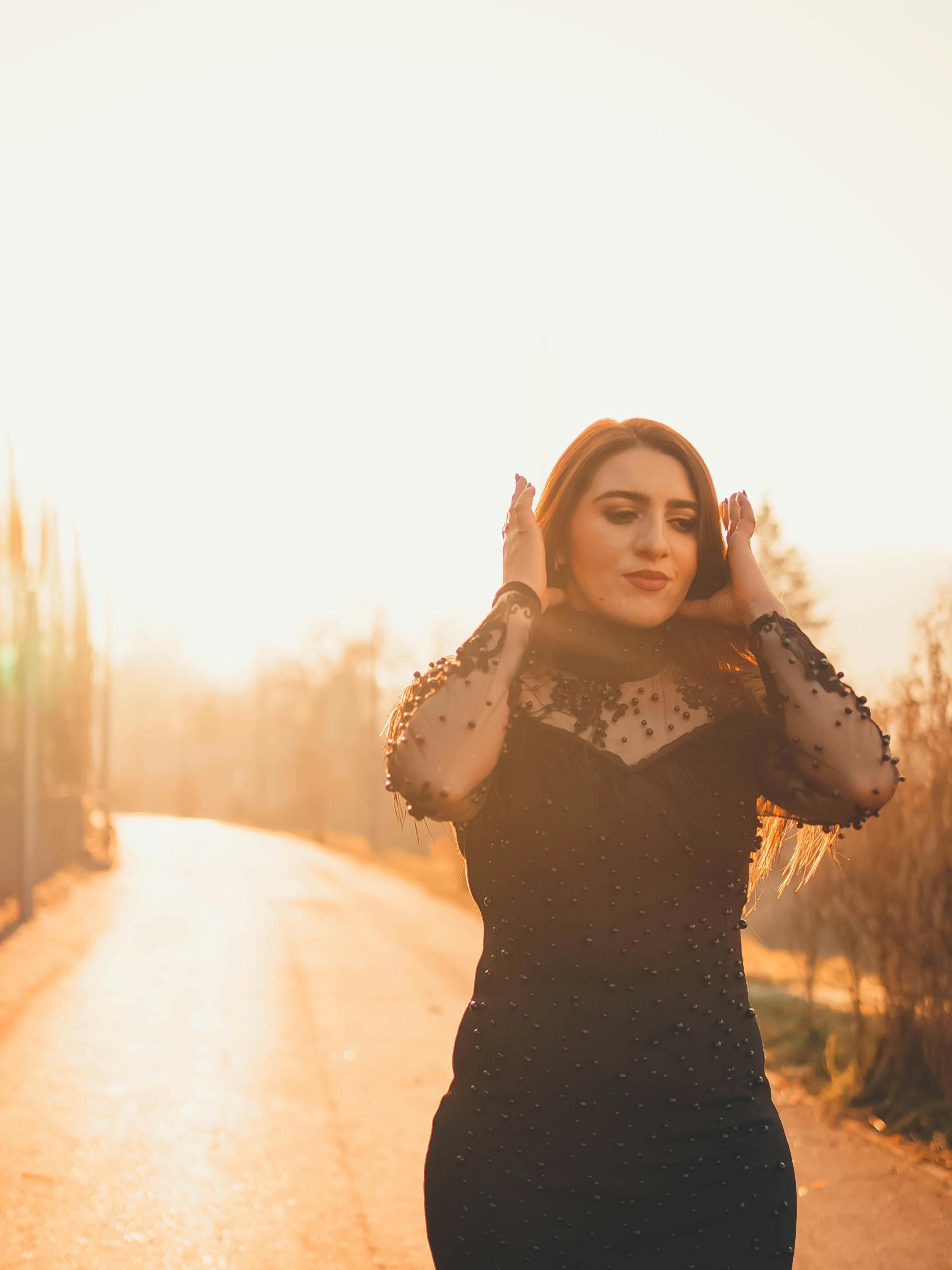 A Woman in Pilot Uniform Standing Infront of Helicopter · Free Stock Photo
