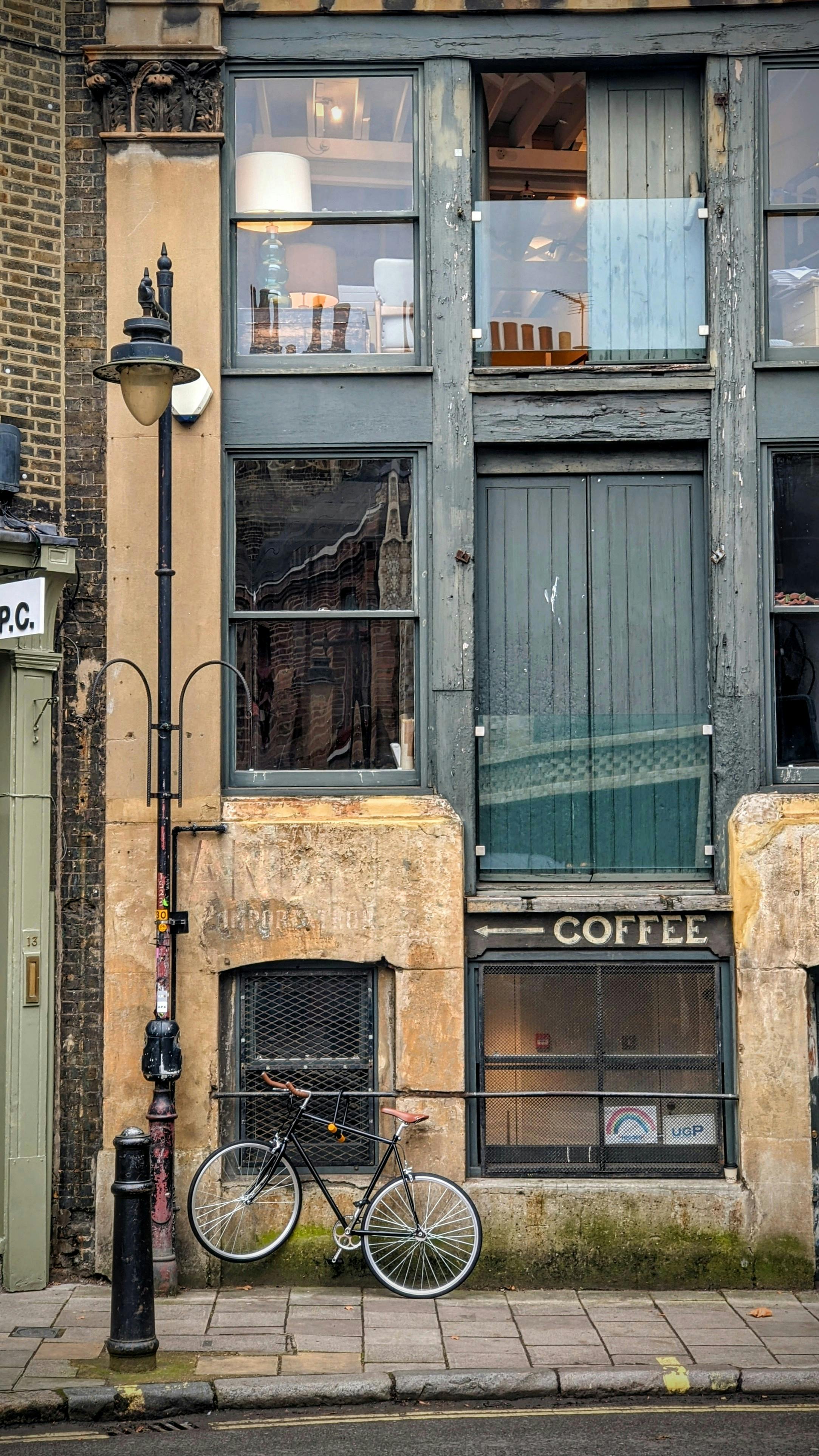 Sign of Coffee Shop on Ancient Building · Free Stock Photo