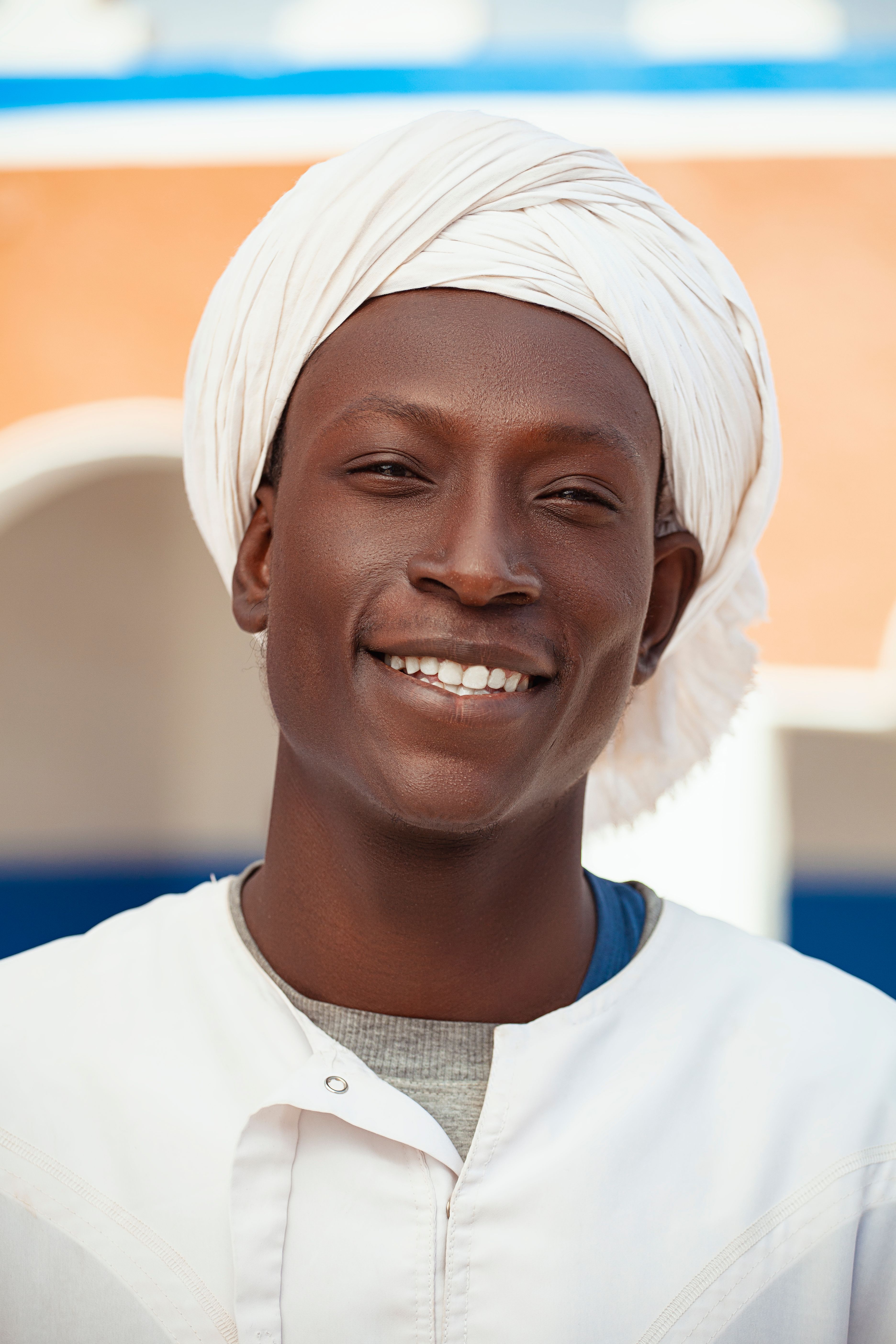 Smiling Man Wearing a White Turban · Free Stock Photo