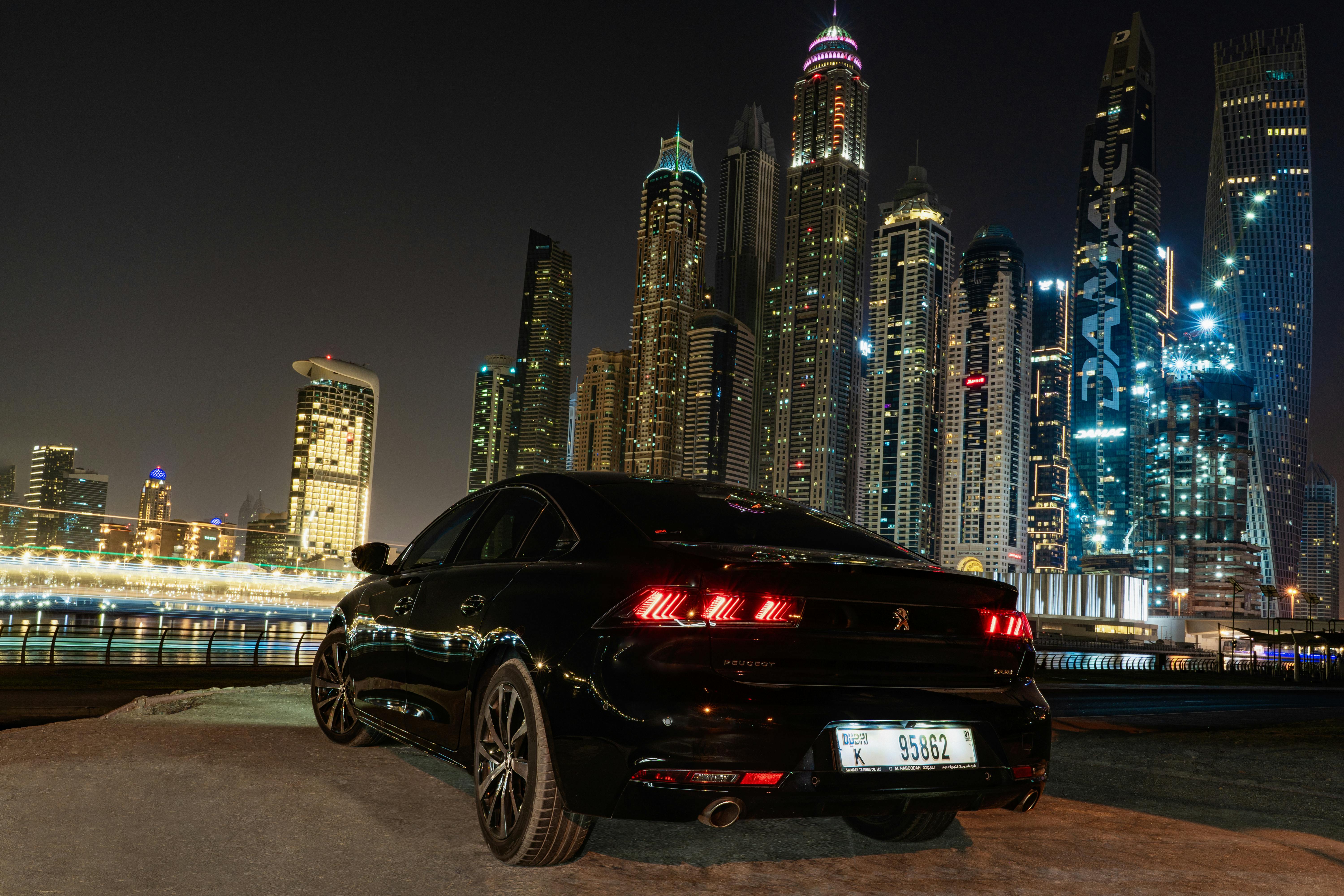 Black Vehicle Parked Near Buildings · Free Stock Photo