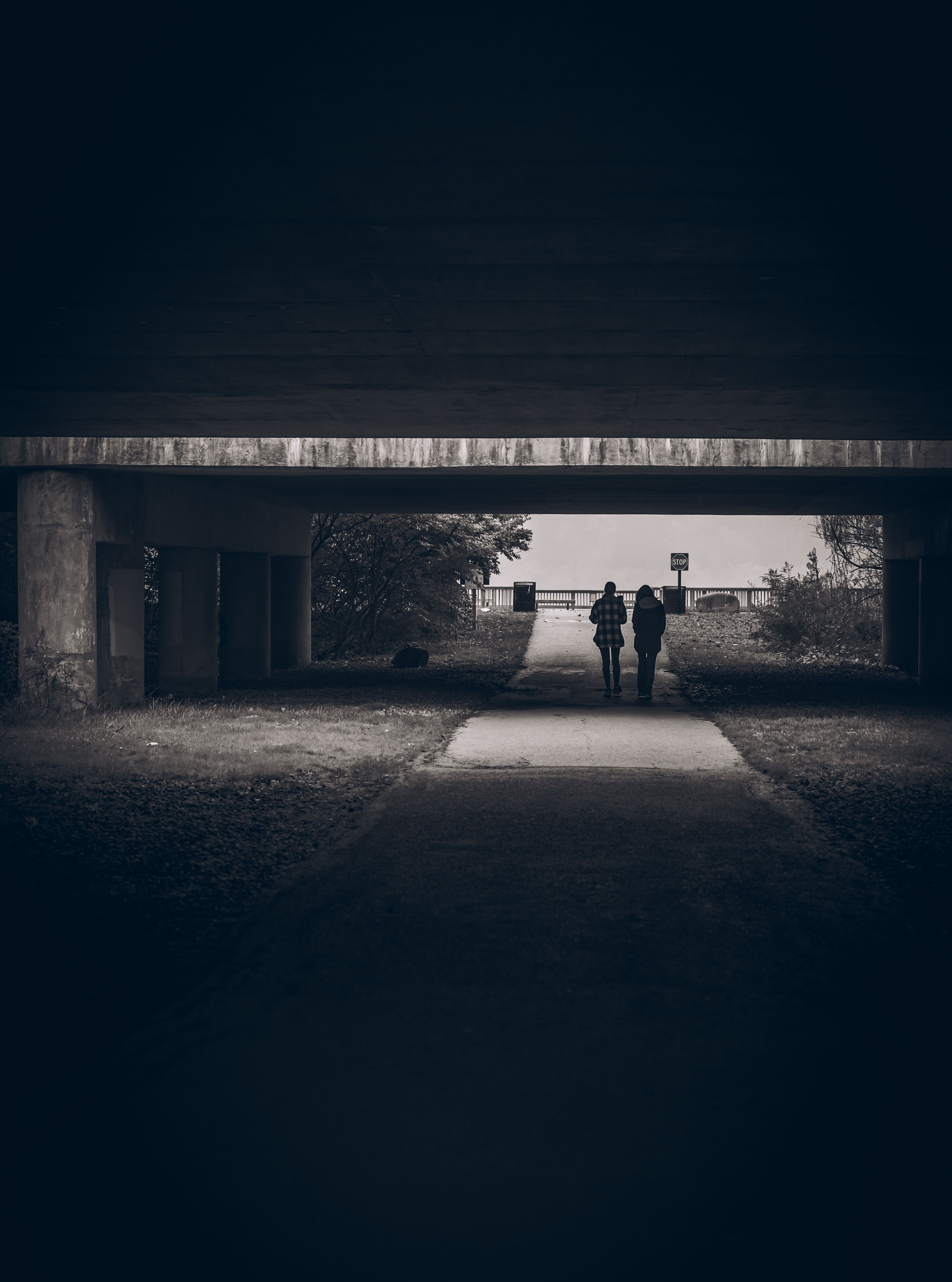 People Walking Under the Bridge · Free Stock Photo