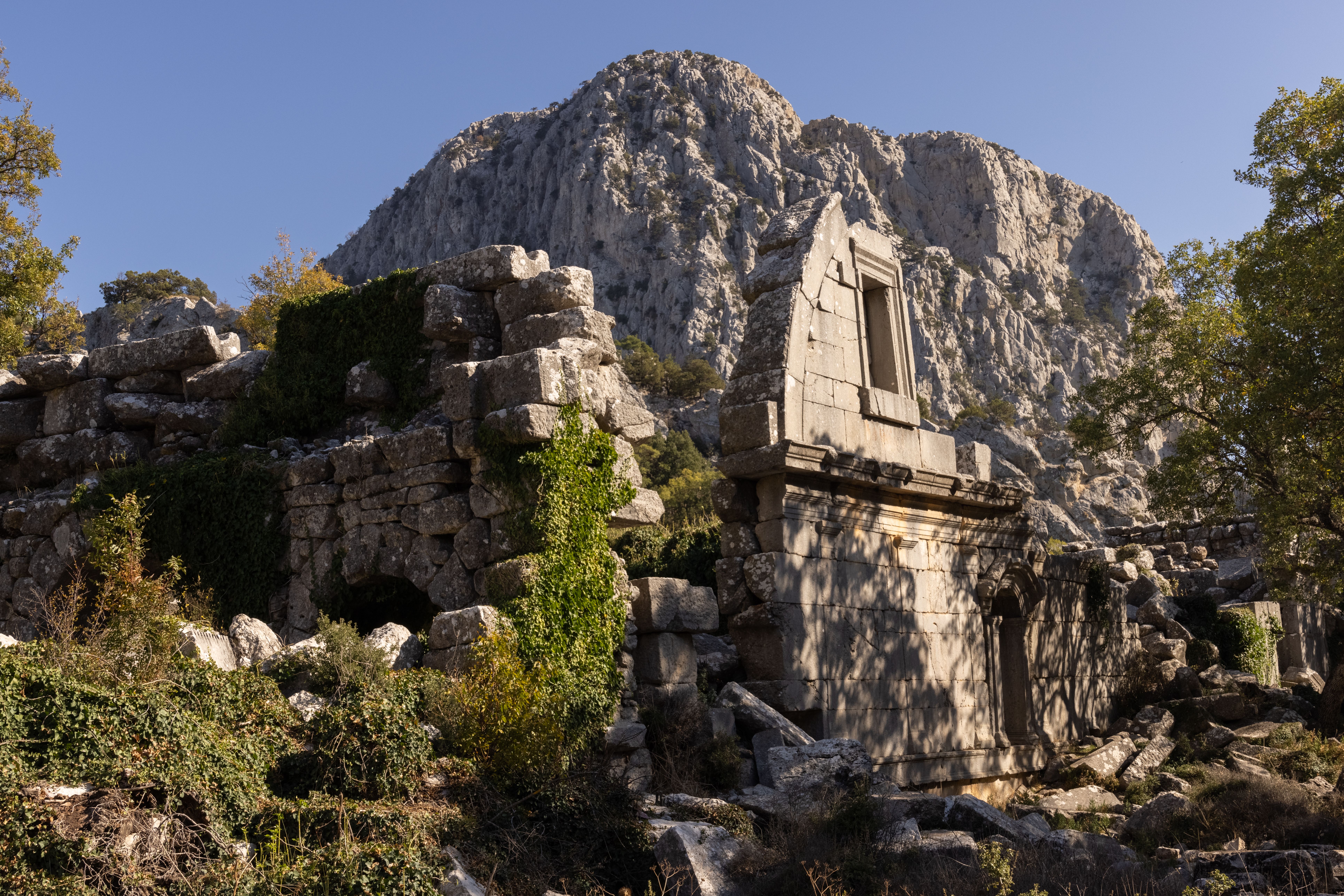 A Ruined Building Near Gray Rocky Mountain Under Blue Sky · Free Stock ...