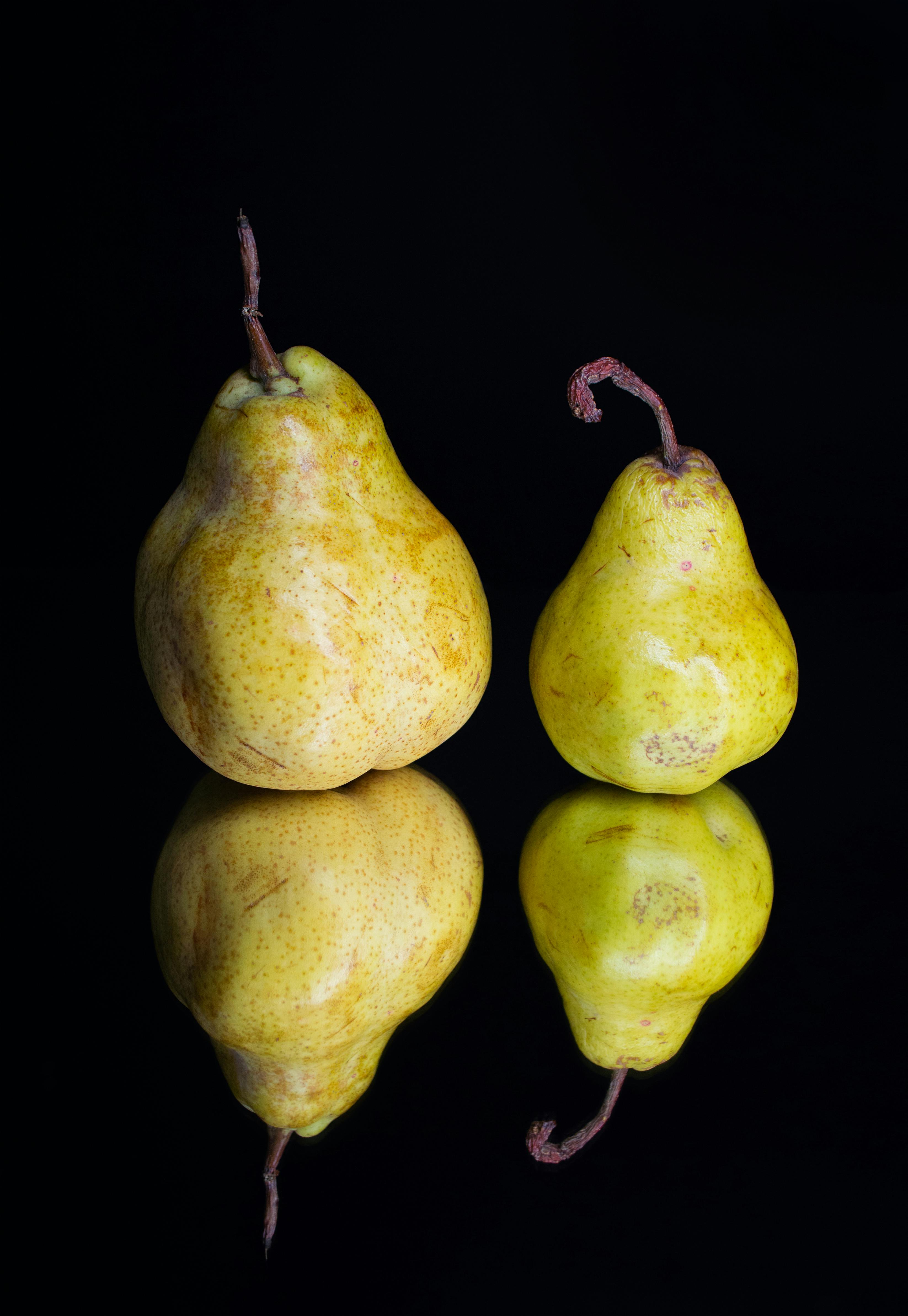 Reflection of Pears on Plain Black Background · Free Stock Photo