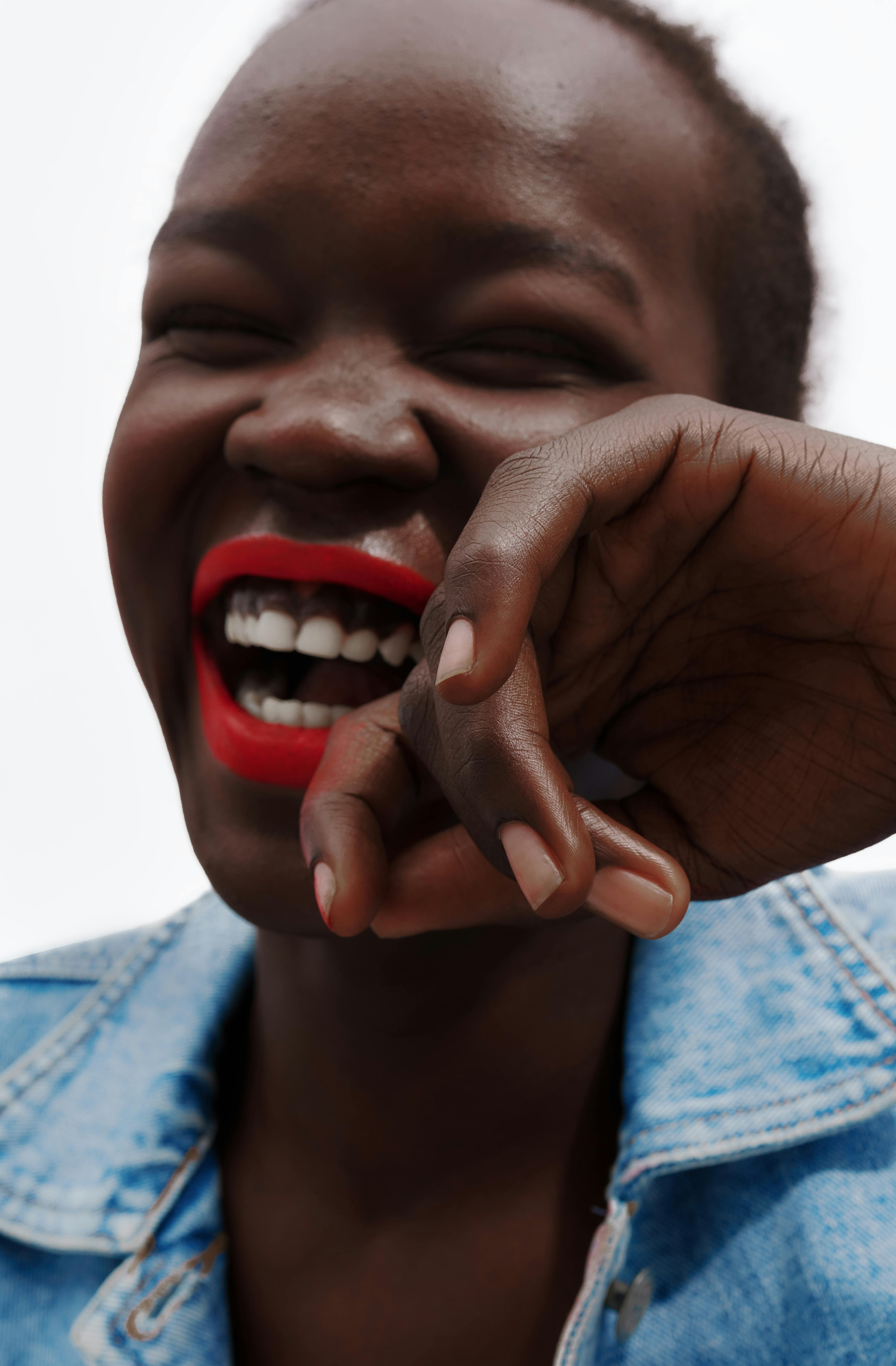 Young Woman with Red Lips Laughing · Free Stock Photo
