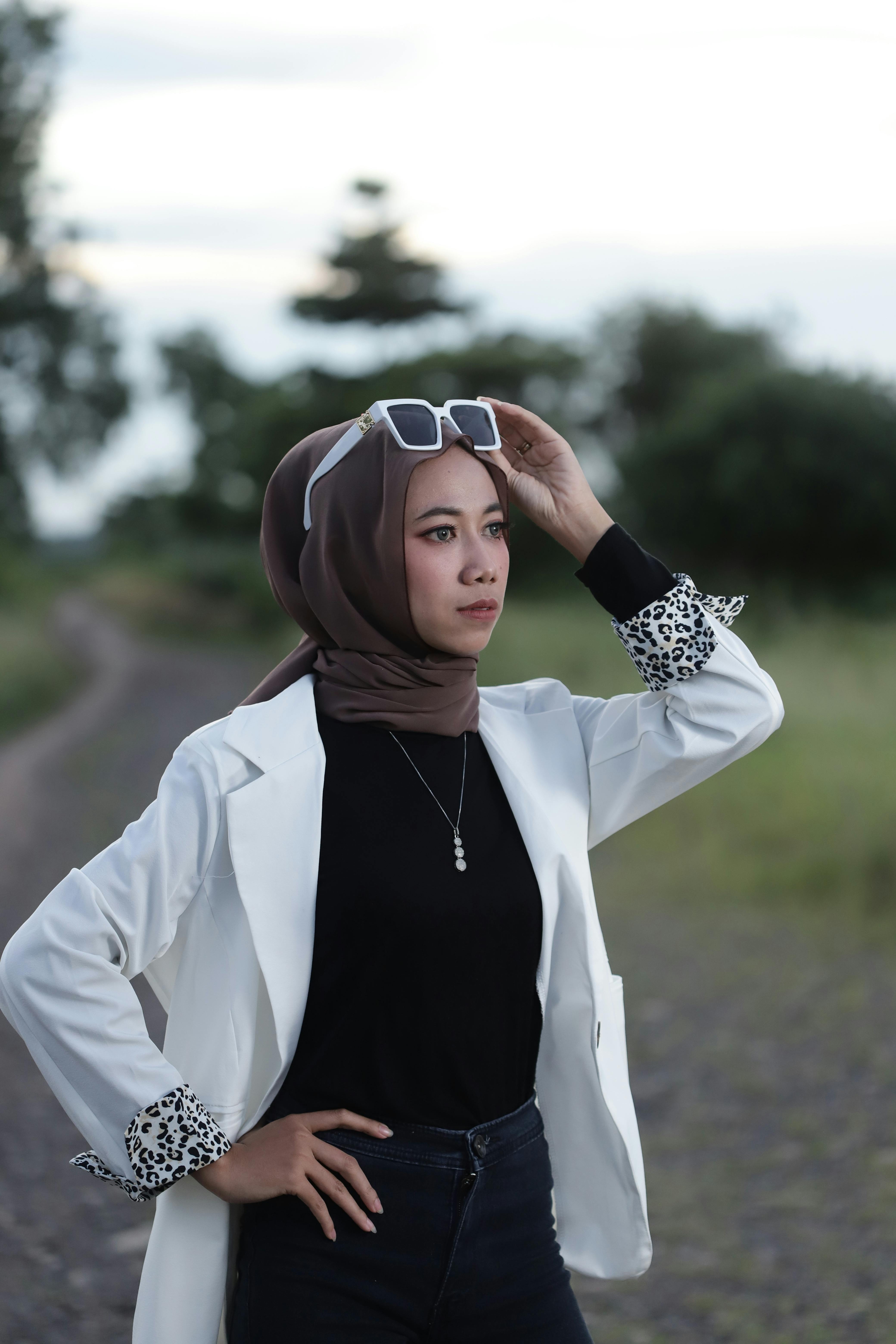 Woman in Hijab Posing in Convertible Car · Free Stock Photo