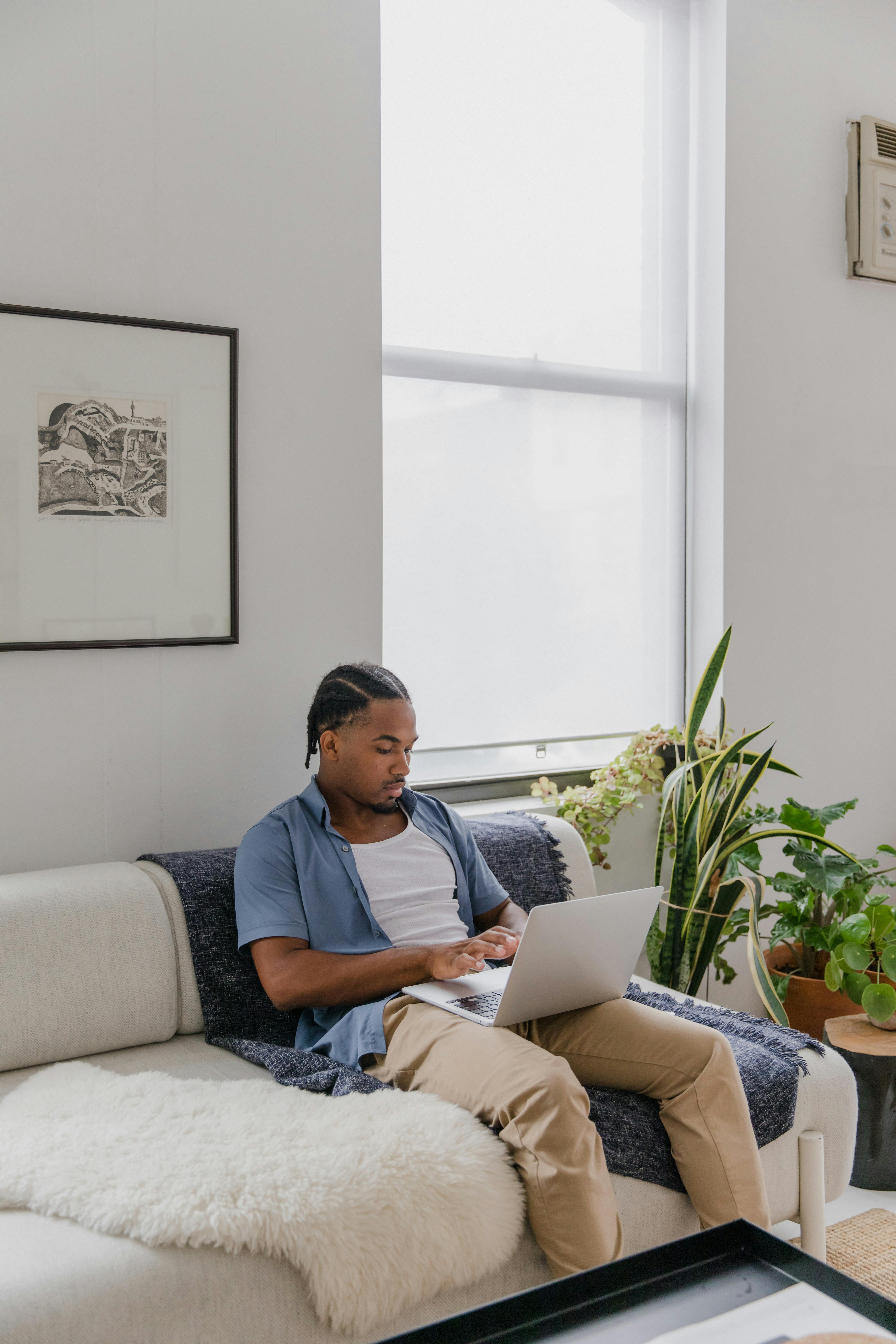 Sitting Man with Laptop on Lap · Free Stock Photo