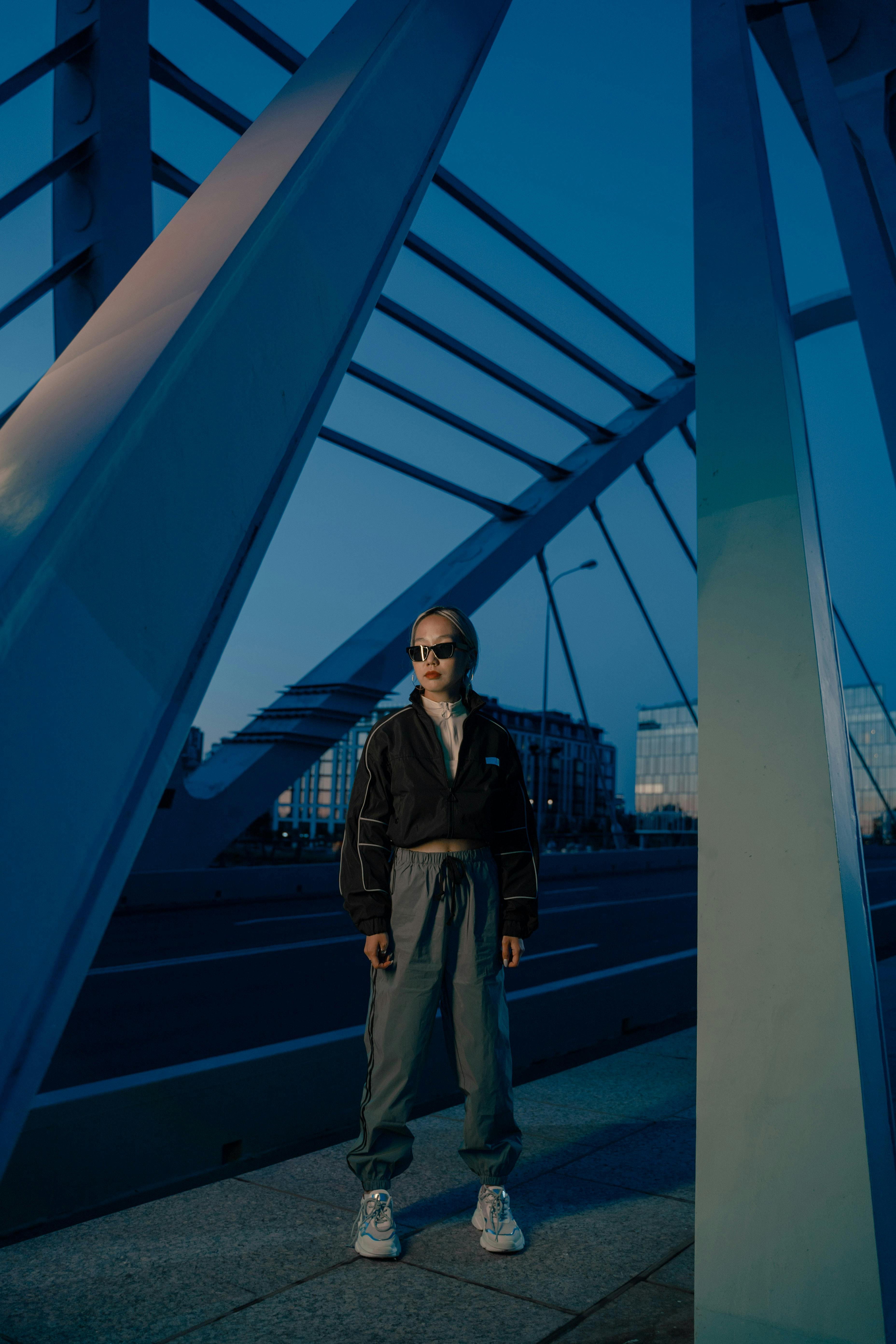 Low-Angle Shot of a Woman in Streetwear Posing for the Camera · Free ...