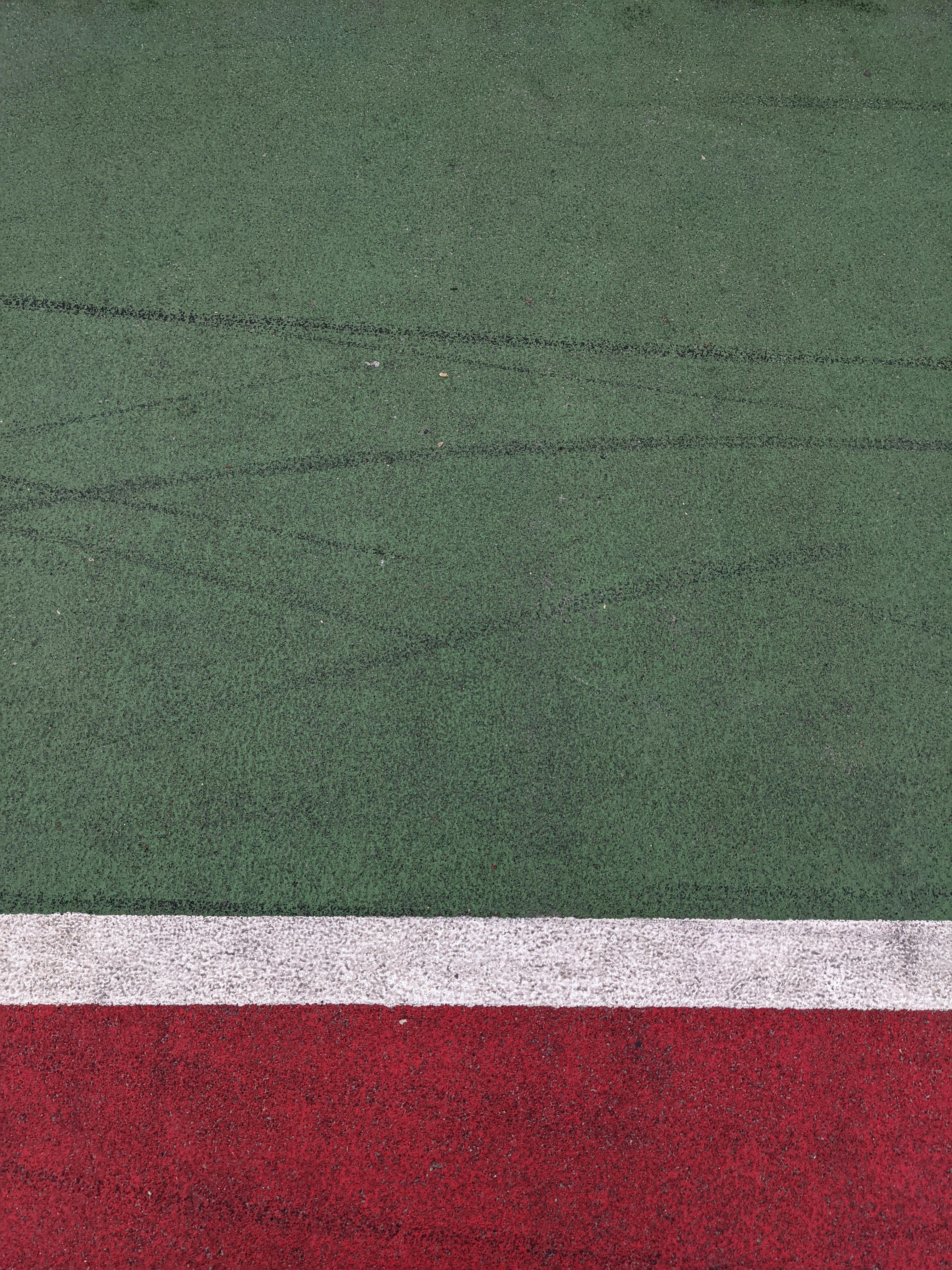 A Green, White and Red Colored Surface · Free Stock Photo