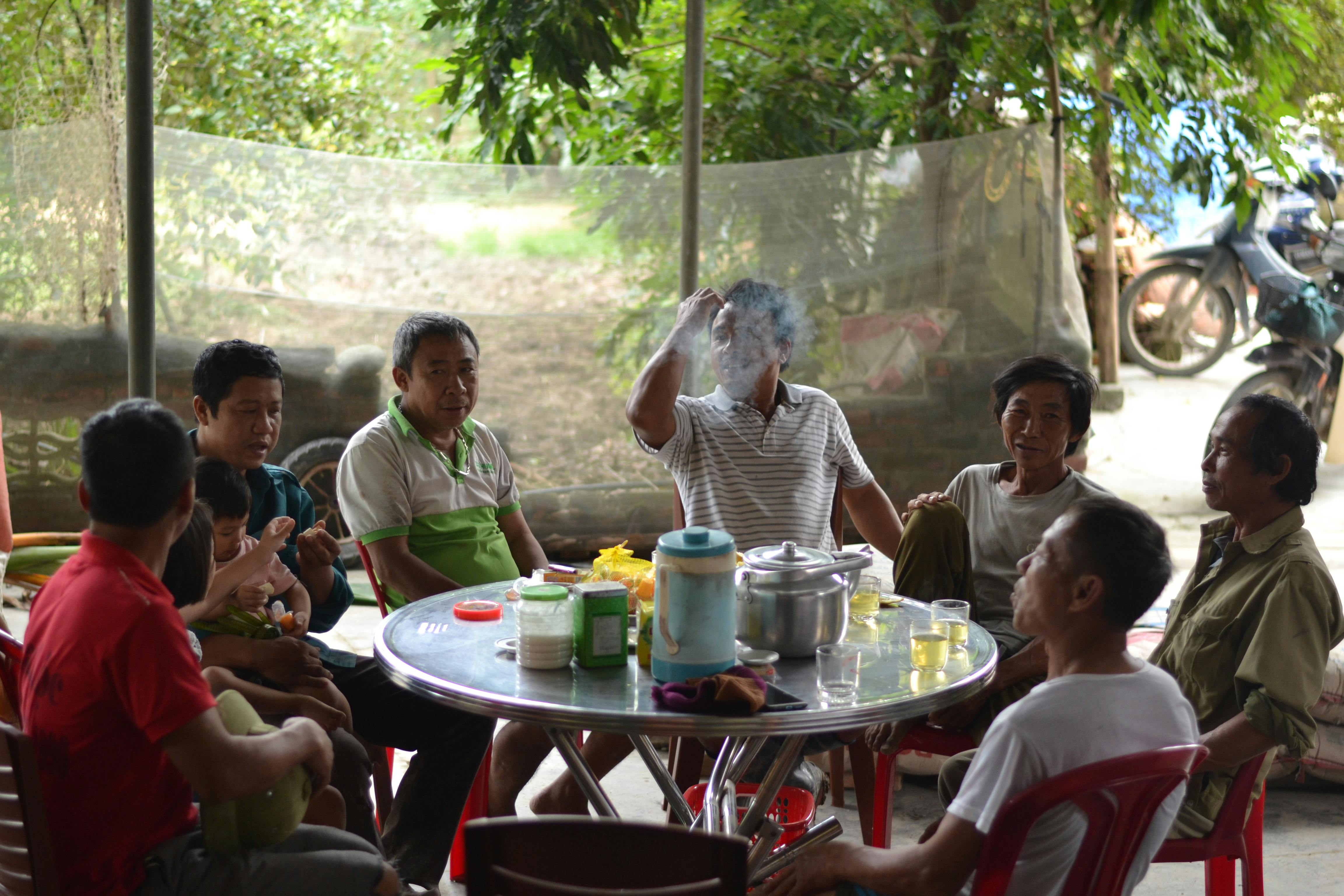 Men Sitting around Table and Talking · Free Stock Photo