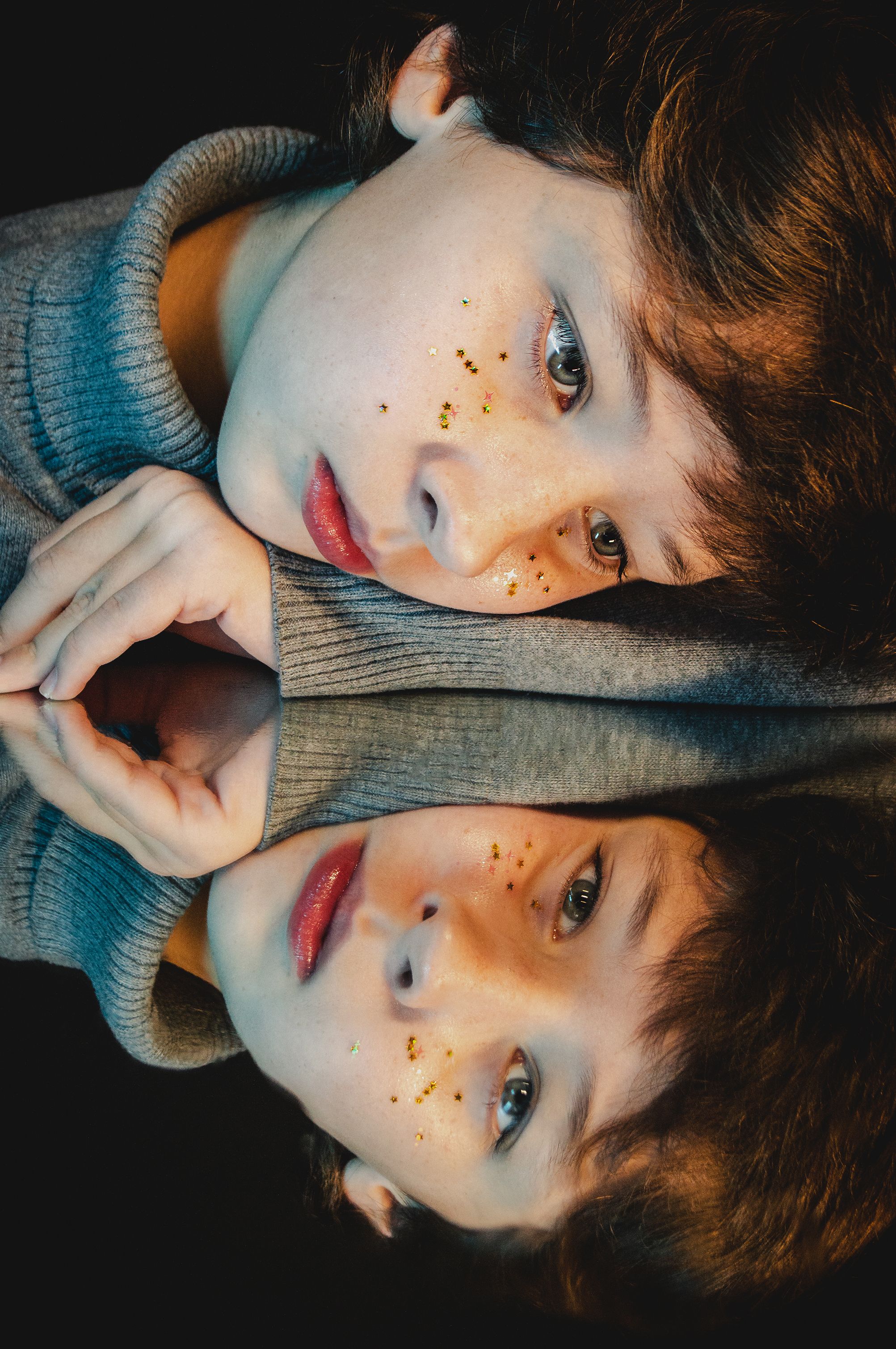 A Kid in Gray Sweater with Reflection on Glass Table · Free Stock Photo