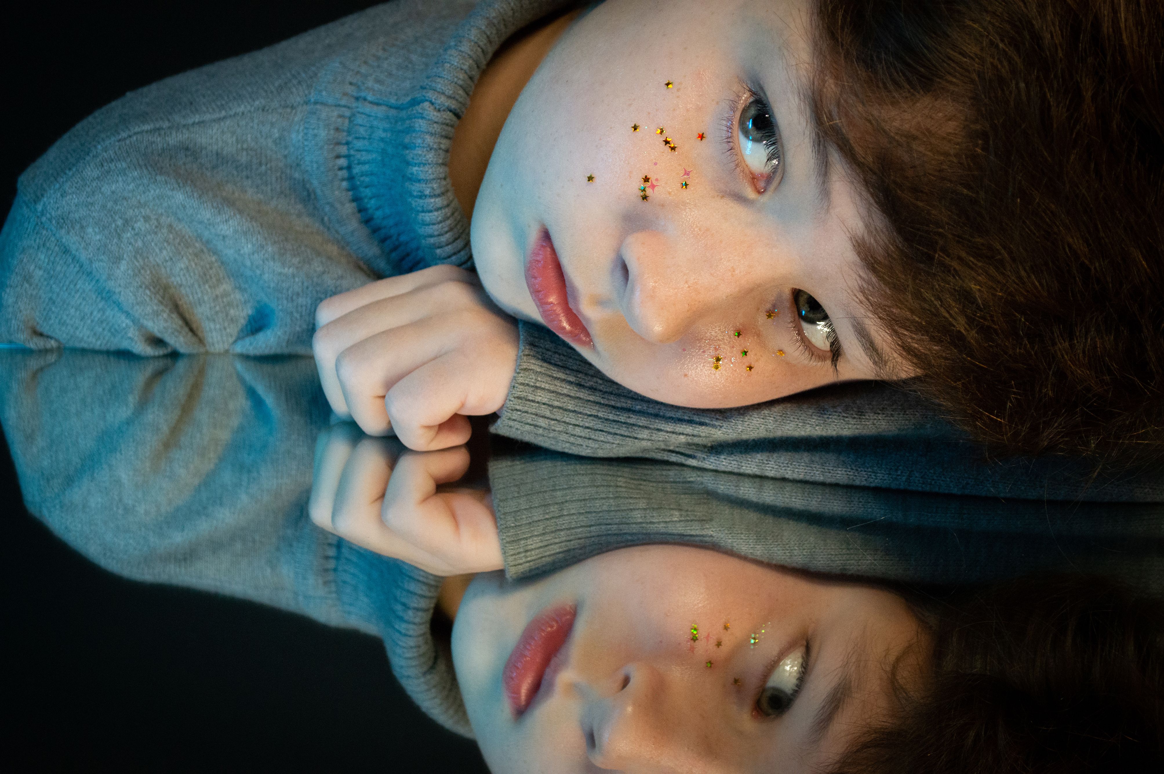 A Kid in Gray Sweater Reflection on Glass Surface · Free Stock Photo