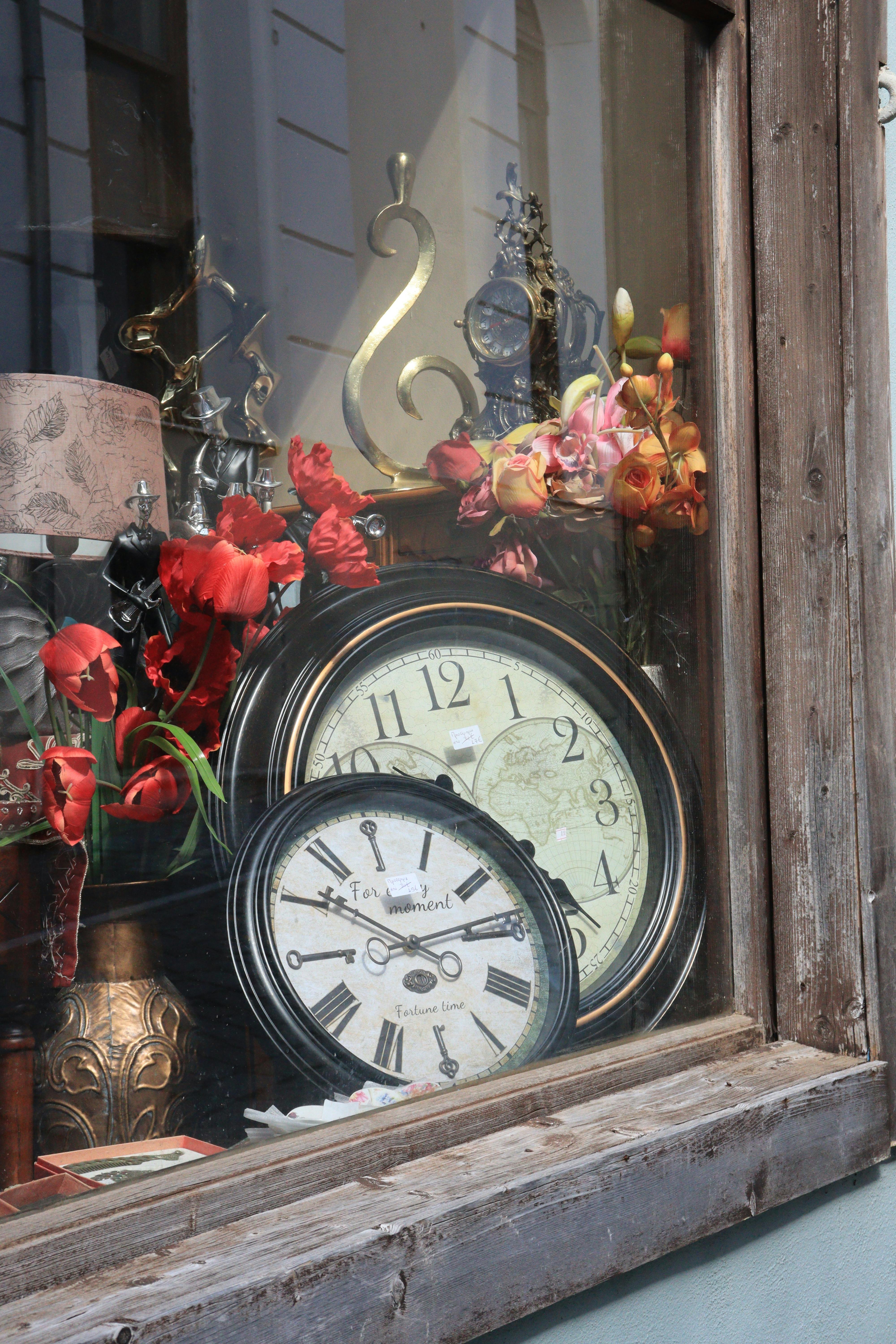 A Pair of Analog Clocks on Window · Free Stock Photo