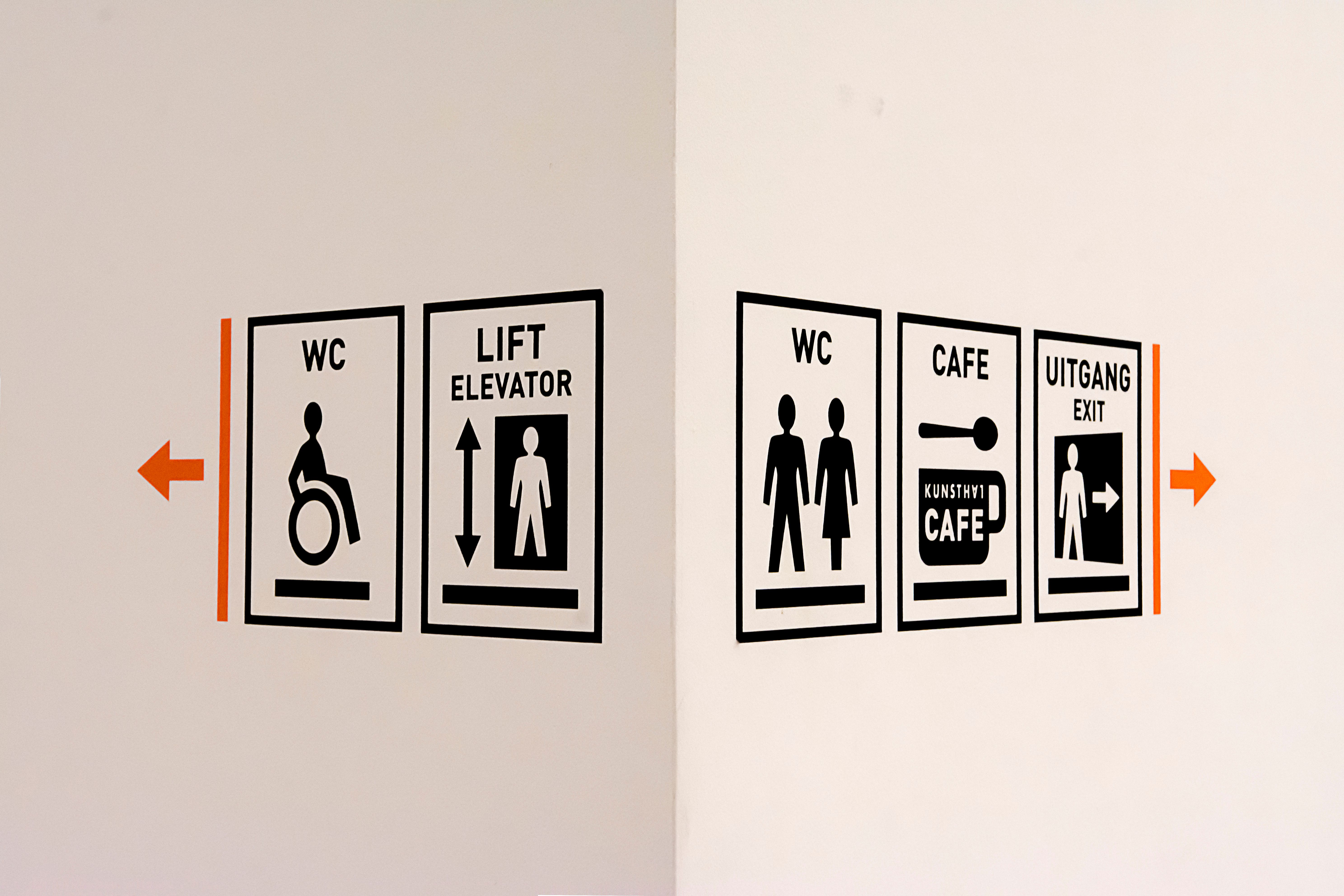 Green and White Male Gender Rest Room Signage · Free Stock Photo