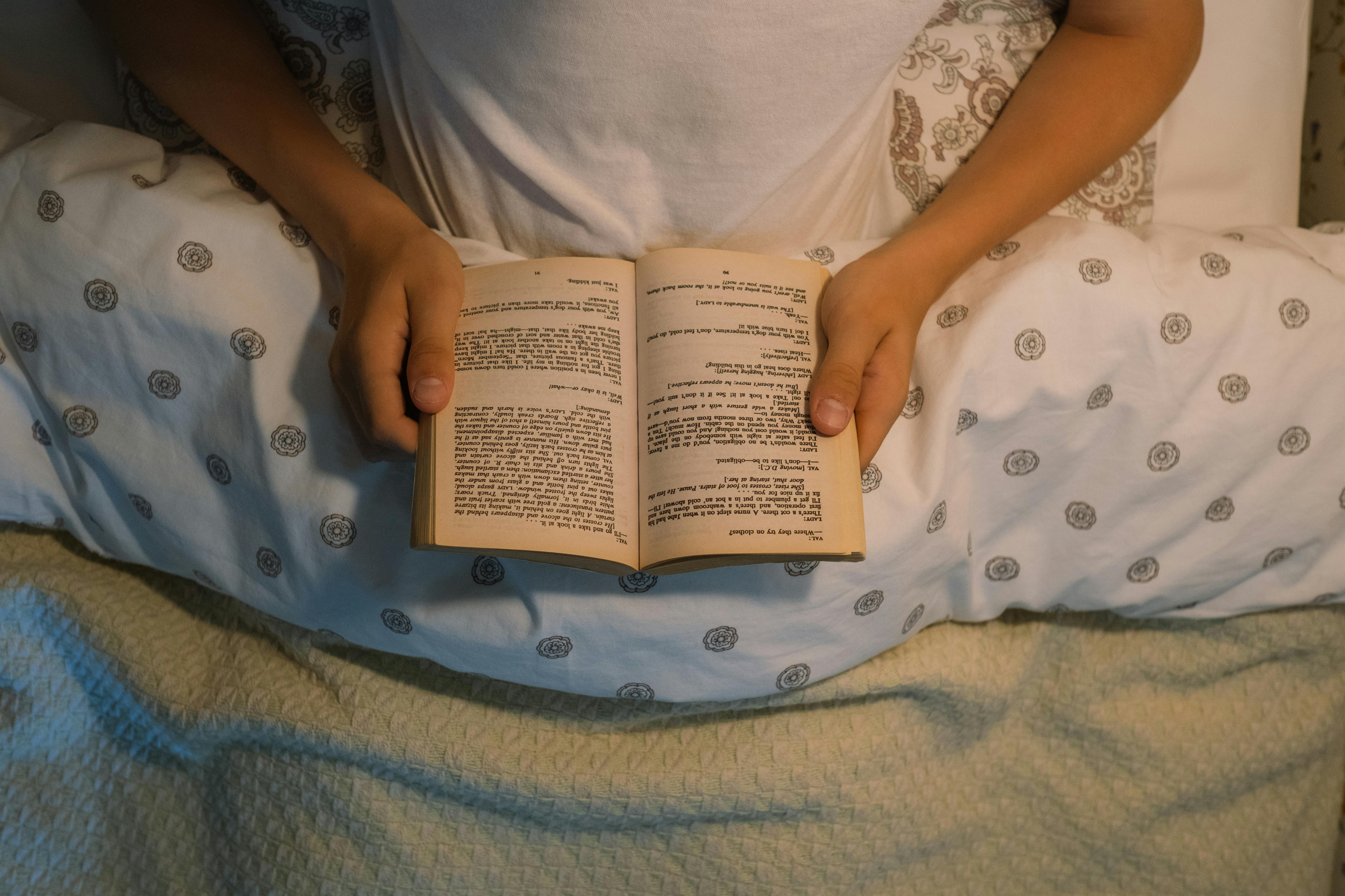 Boy Reading Book in Bed · Free Stock Photo