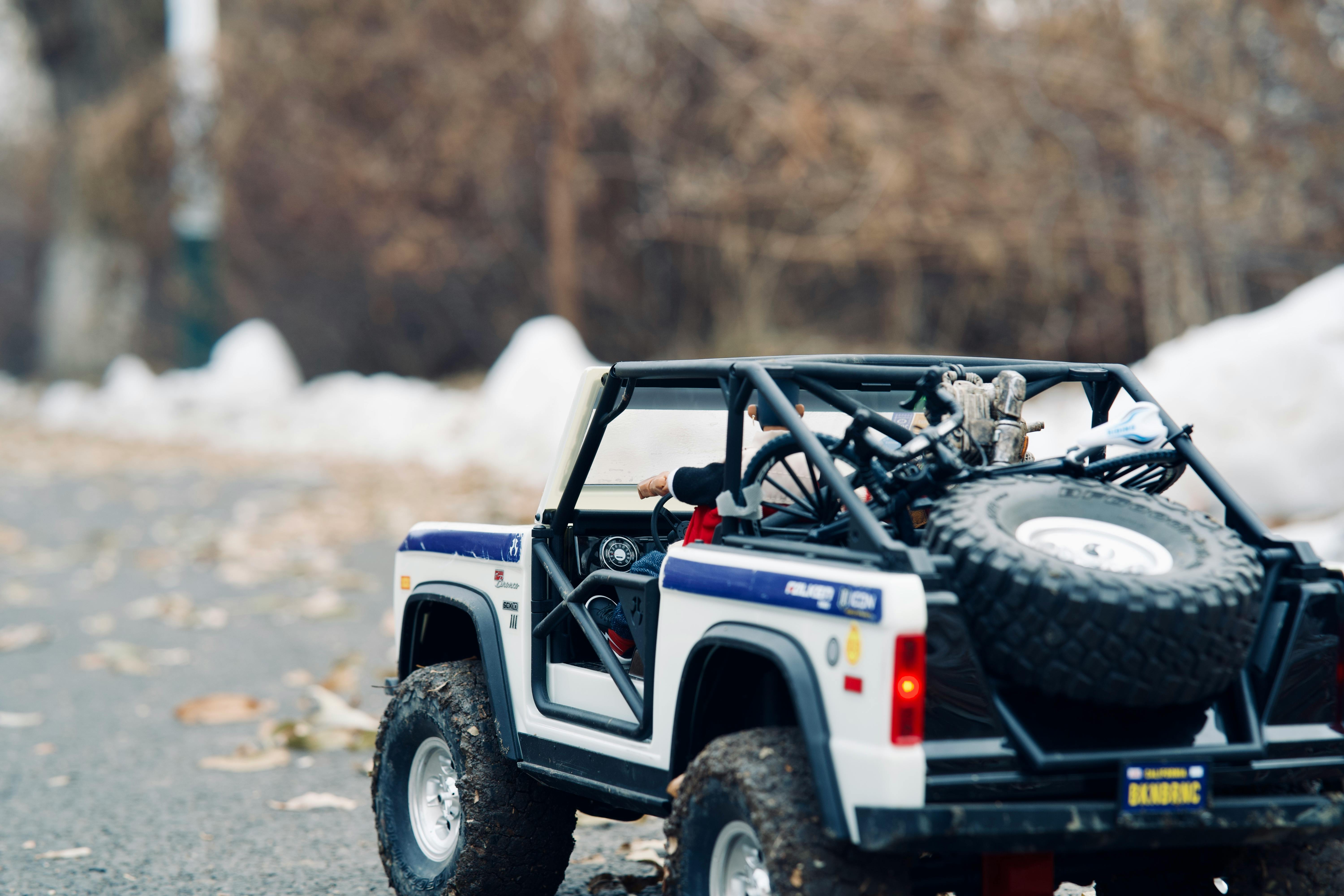 Red 4x4 Car Driving Through Extreme Terrain · Free Stock Photo