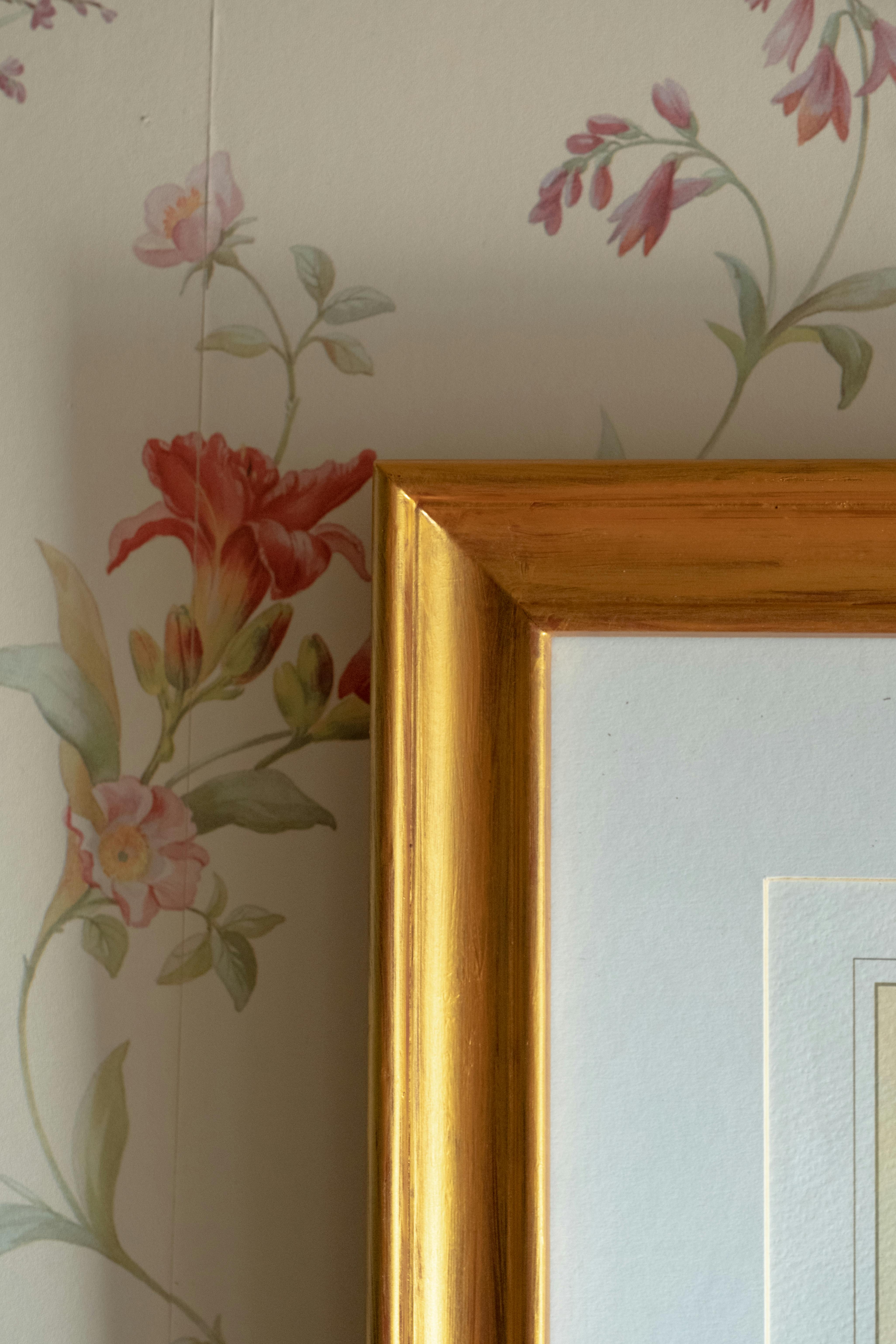 A Selective Shot of Part of a Frame on Bedroom Wallpaper · Free Stock Photo