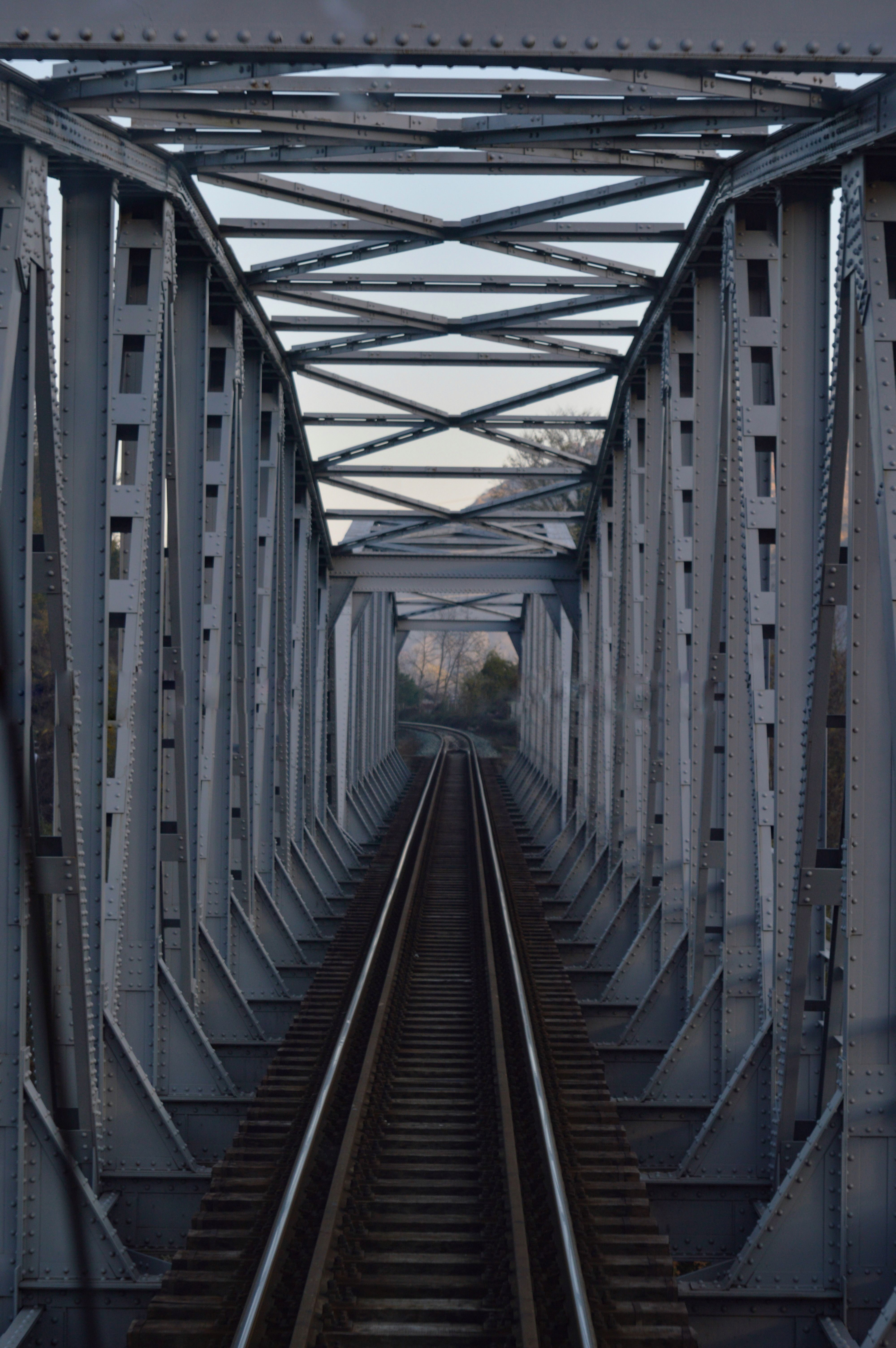 Man Jumping from Railway Bridge · Free Stock Photo