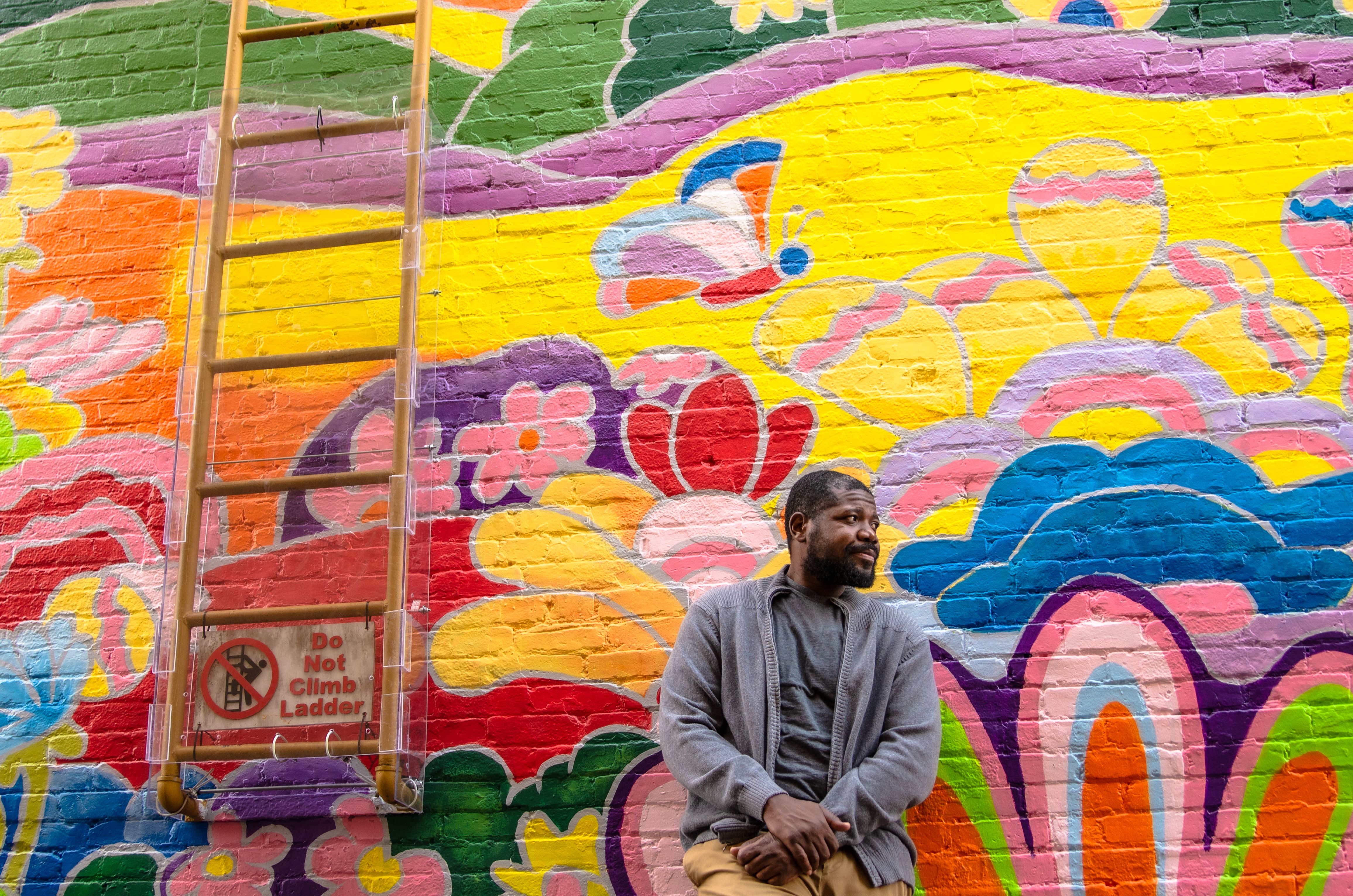A Man Posing with Painted Wall · Free Stock Photo