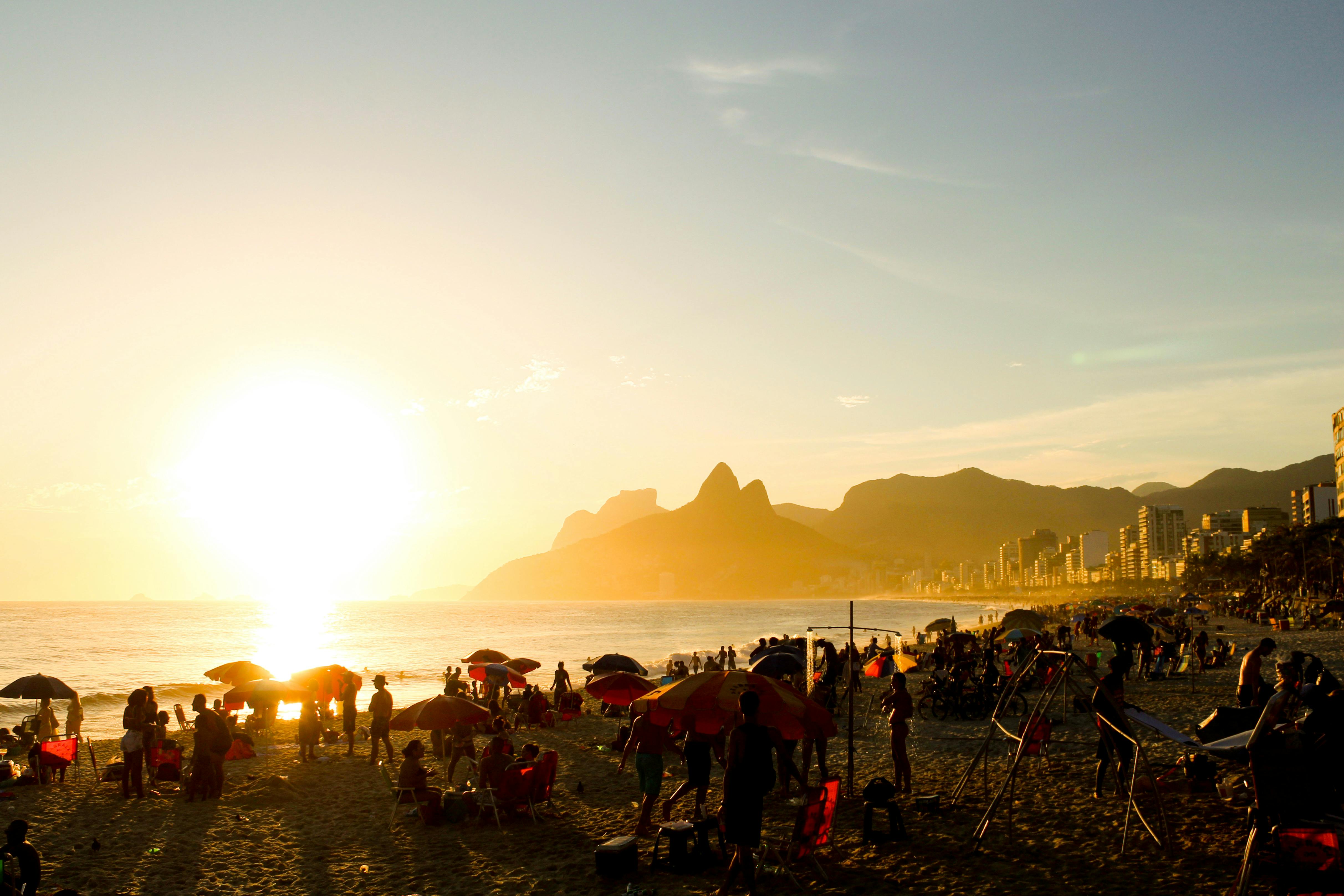 People on the Beach during Sunset · Free Stock Photo