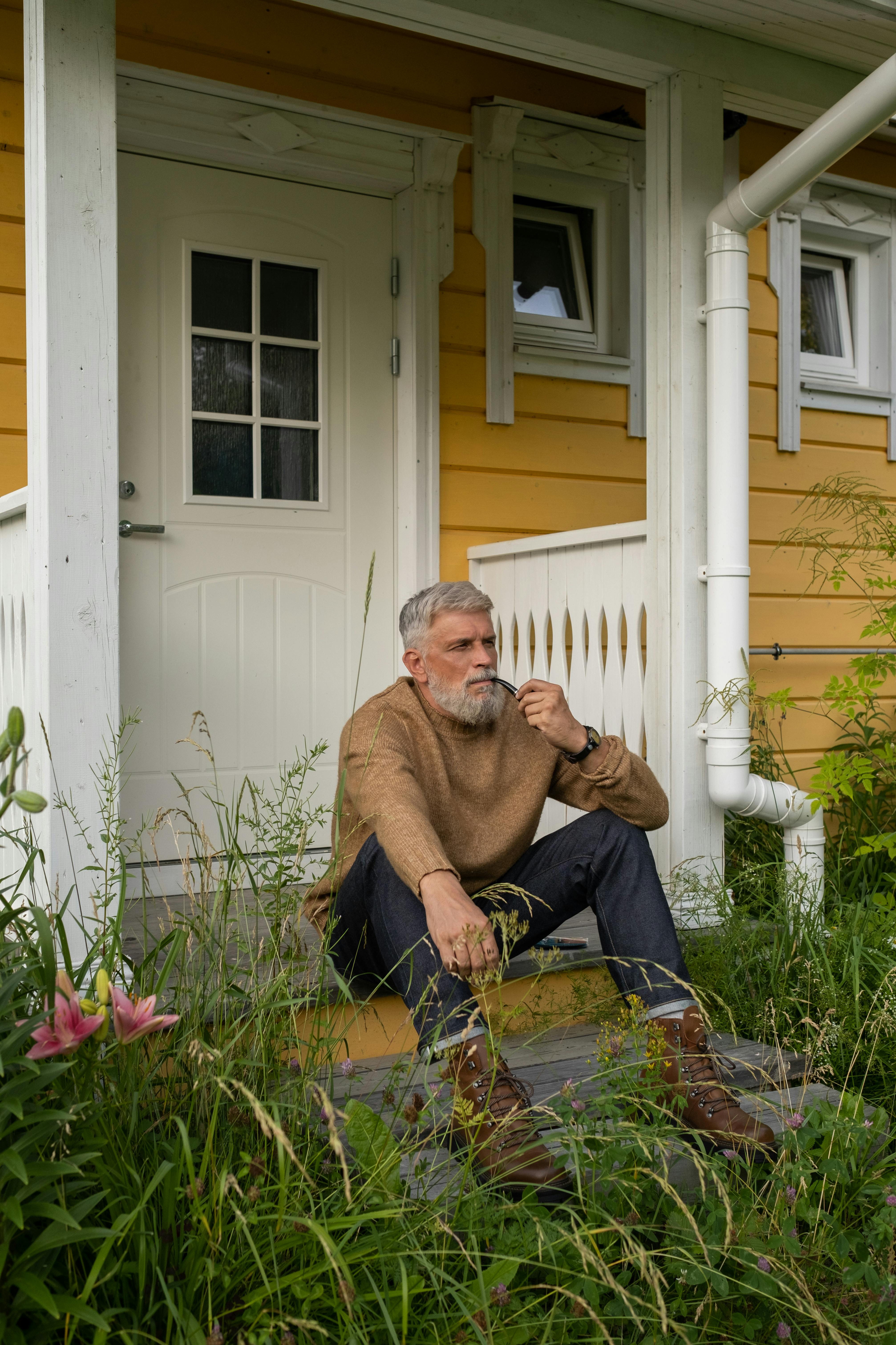 Elderly Man Sitting On Porch · Free Stock Photo