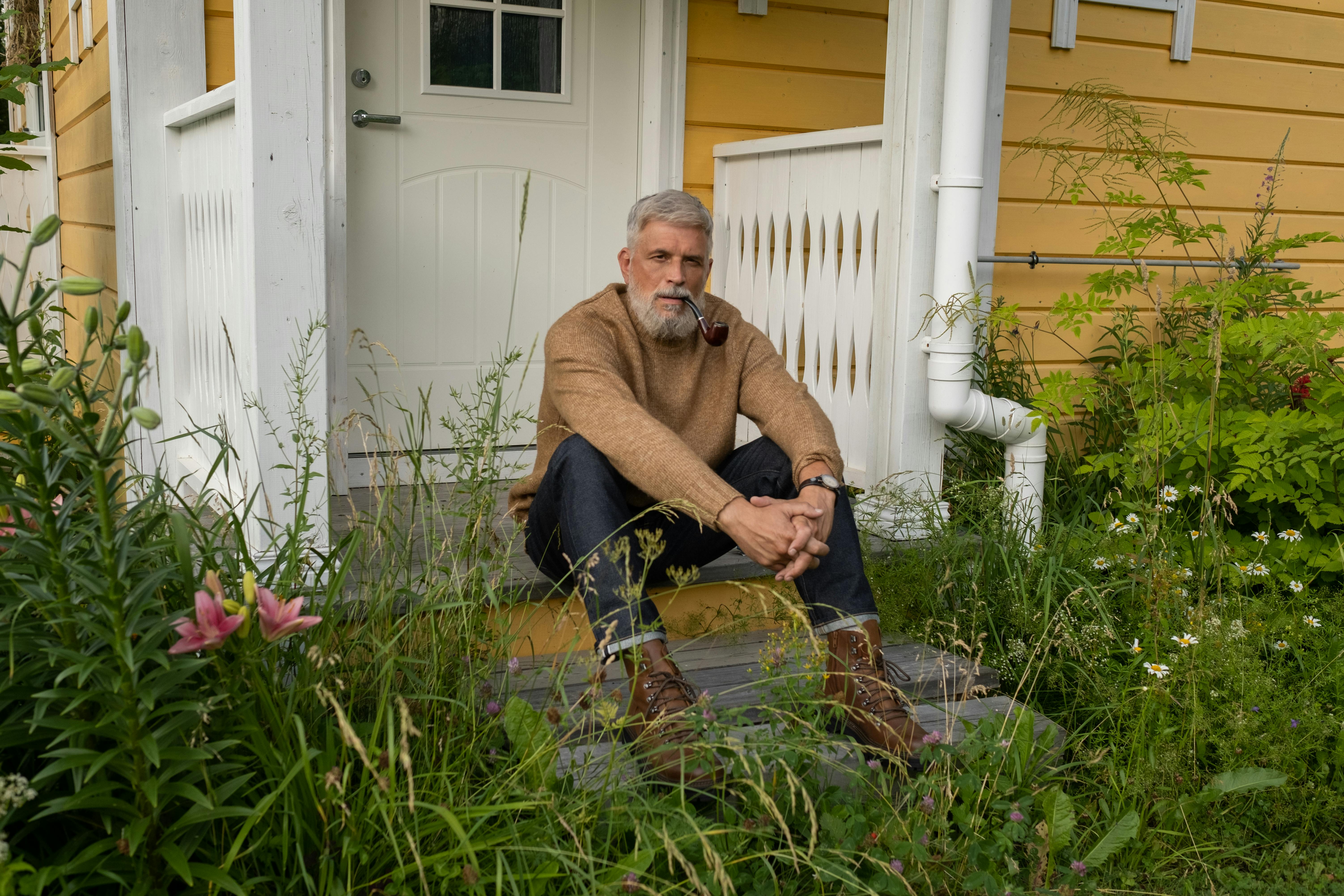 Elderly Man Sitting On Porch · Free Stock Photo