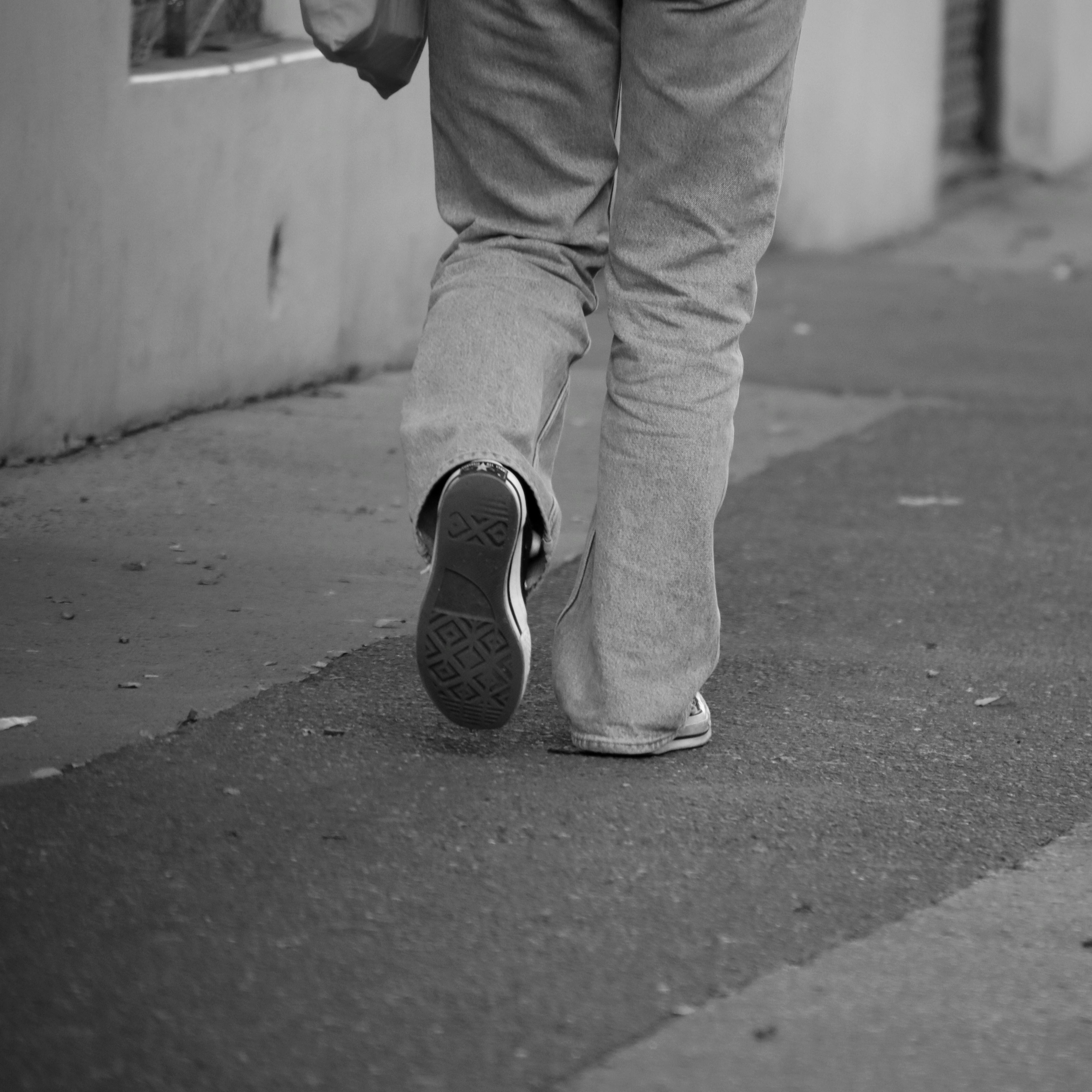 Black and White Photo of Walking on the Sidewalk · Free Stock Photo