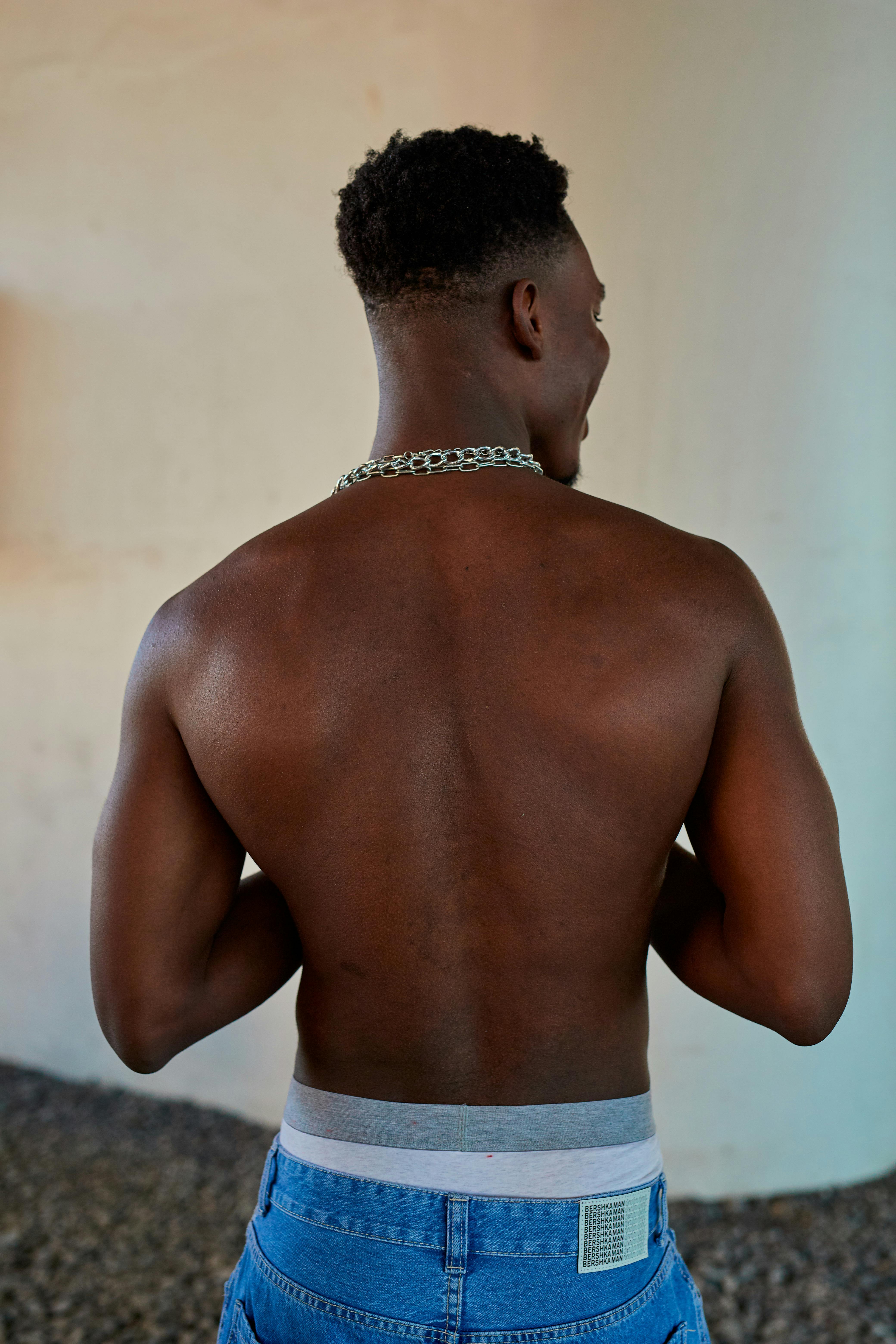 Broad Back of a Shirtless Man · Free Stock Photo