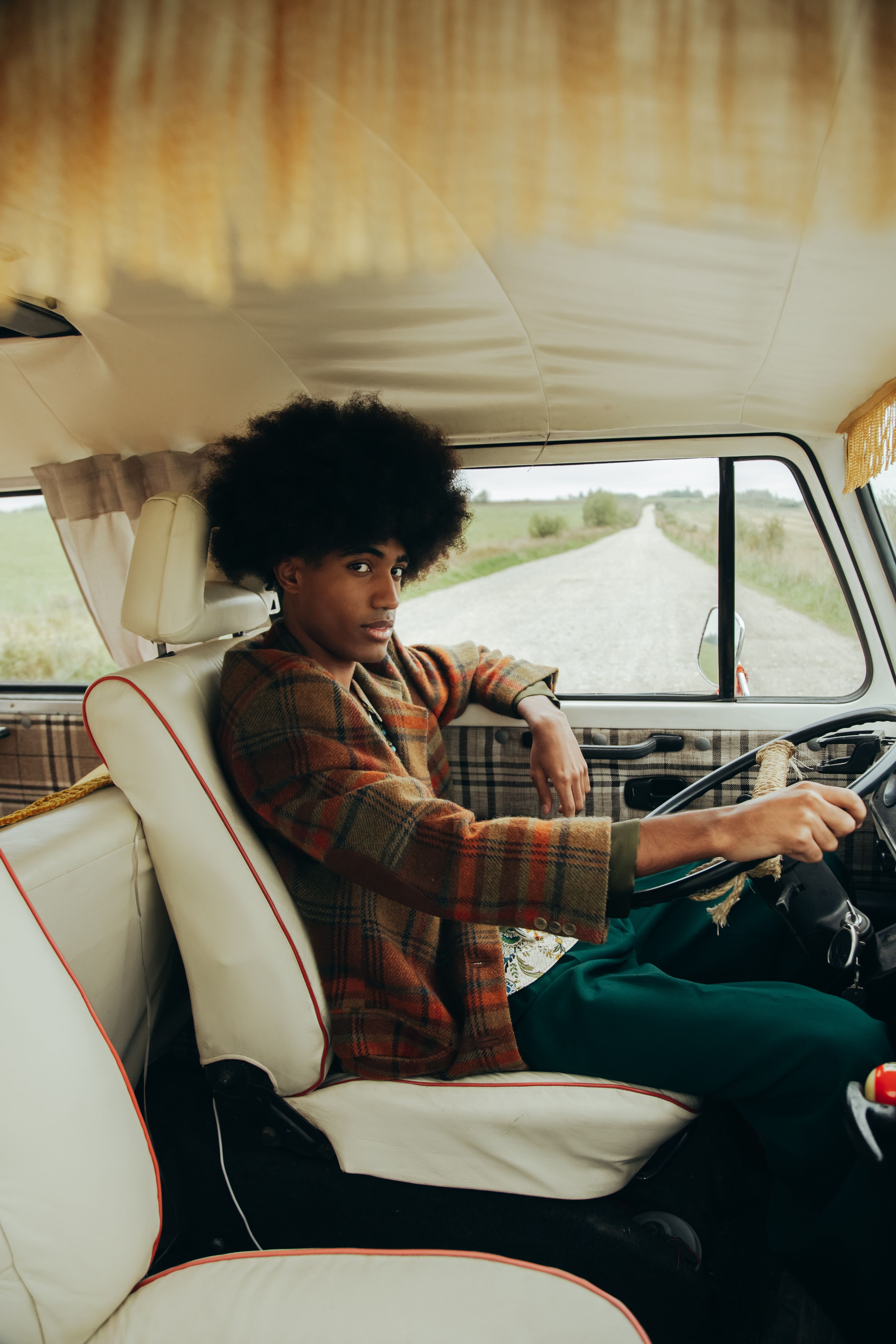 A Smiling Man Driving a Jeep · Free Stock Photo