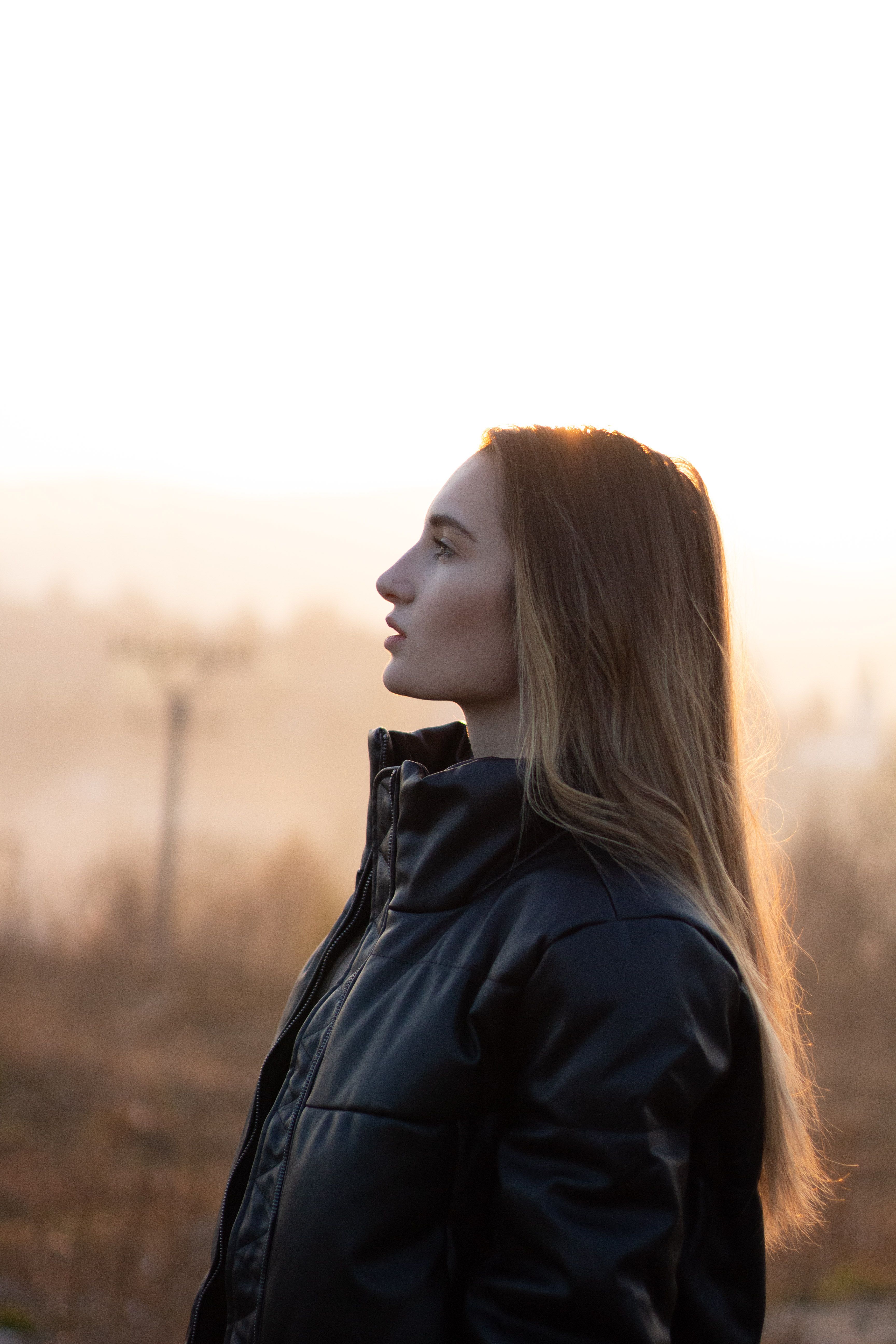 A Side View of a Woman in Black Jacket · Free Stock Photo