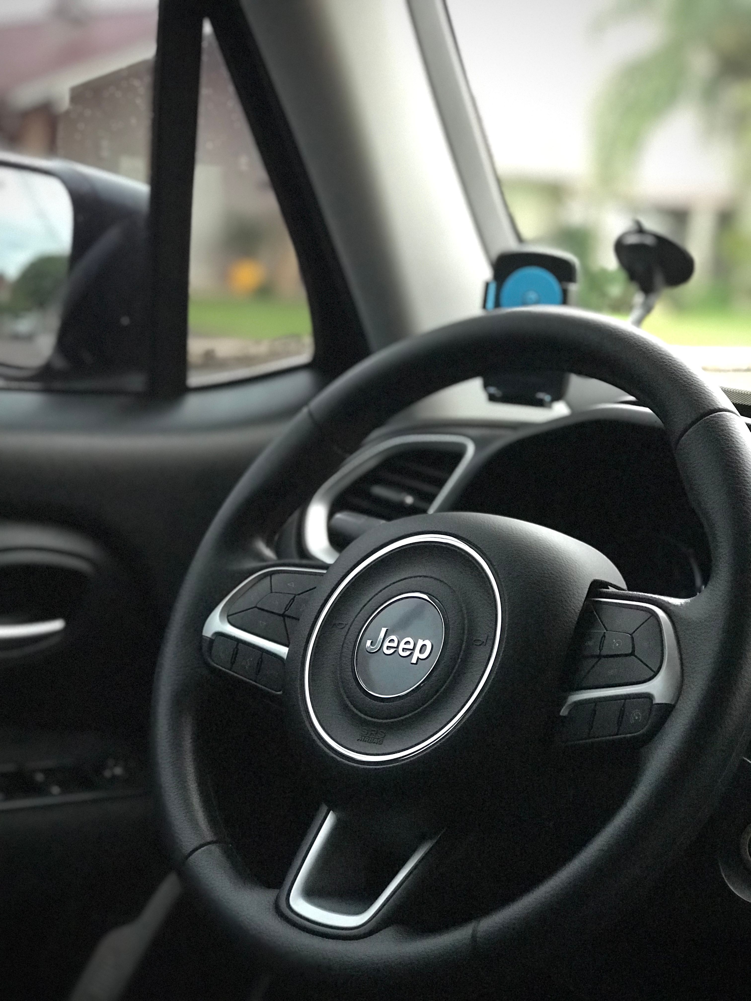 A Black Steering Wheel Inside the Car · Free Stock Photo