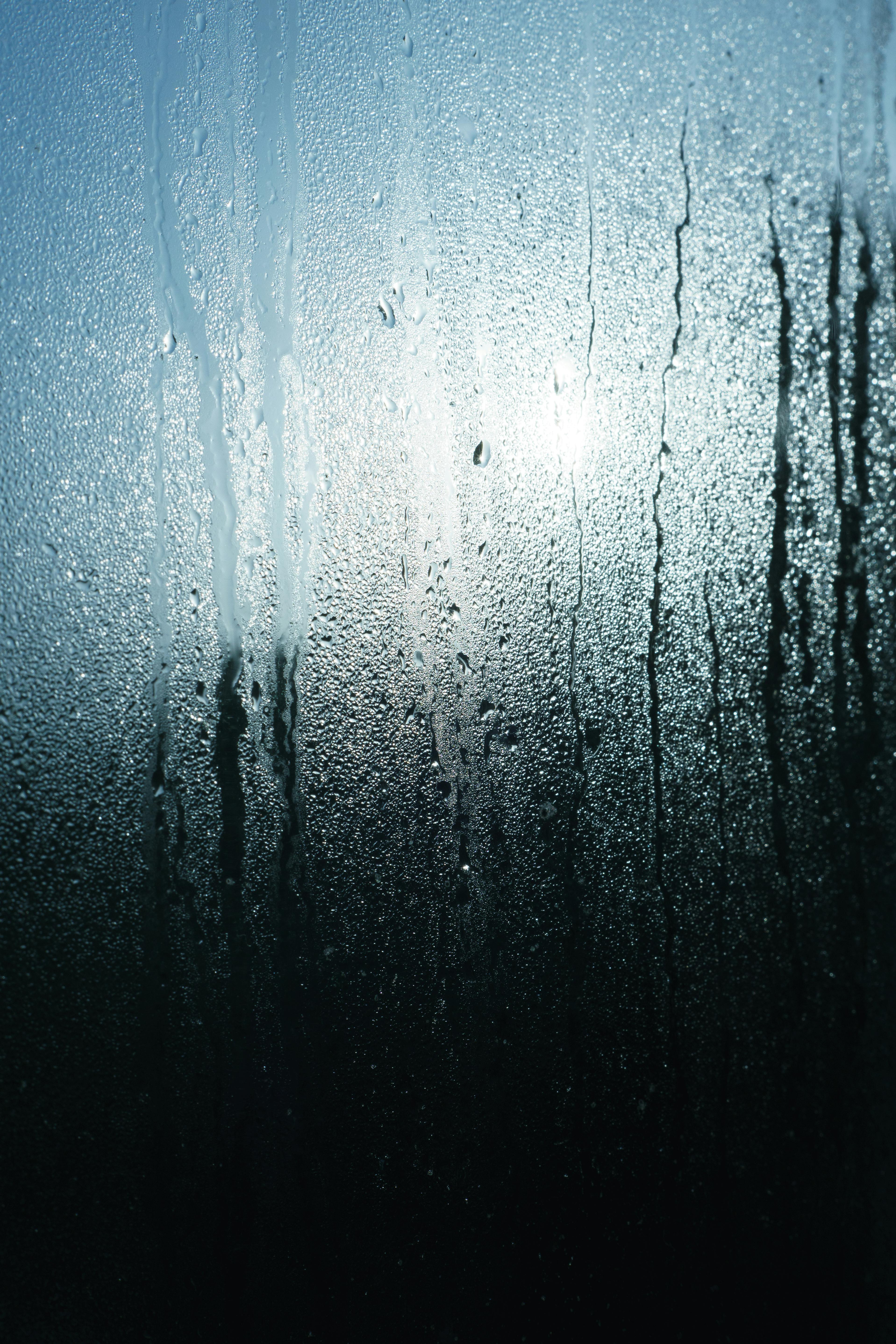 Close-Up of a Wet Glass Pane · Free Stock Photo