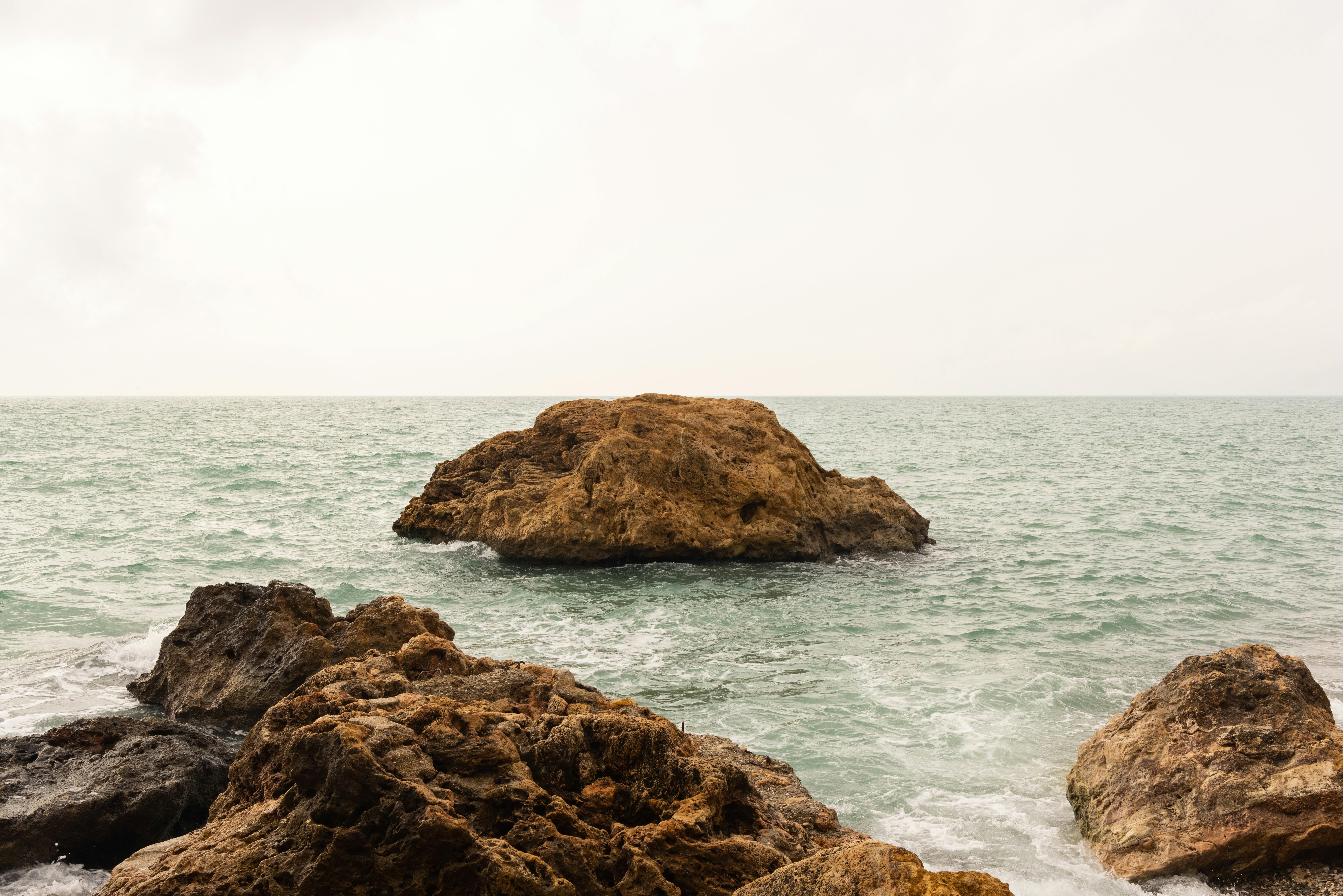 Brown Rock Formation on the Sea · Free Stock Photo