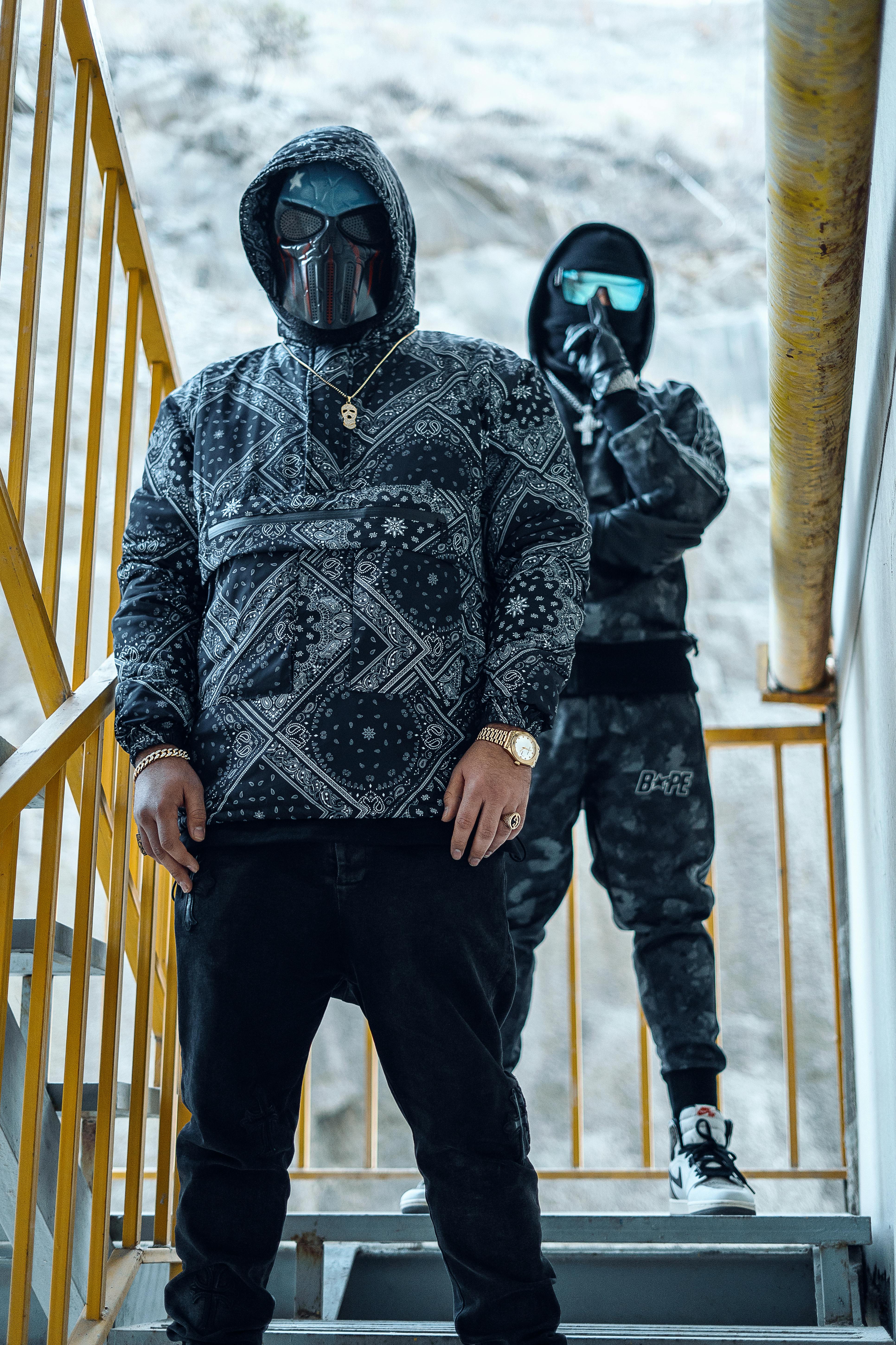 Men in Masks Standing on Stairs · Free Stock Photo