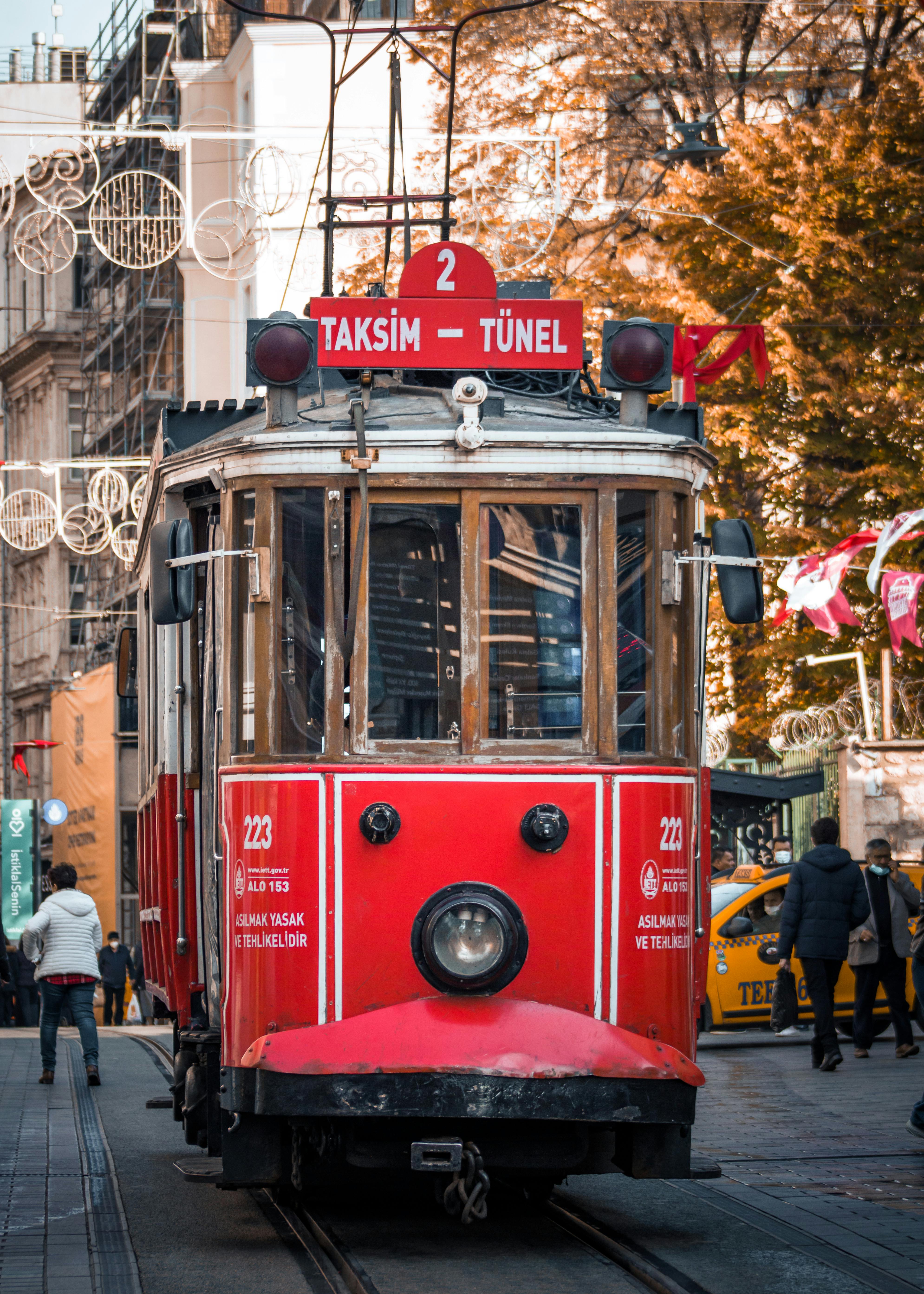 Red and White Tram on the Street · Free Stock Photo