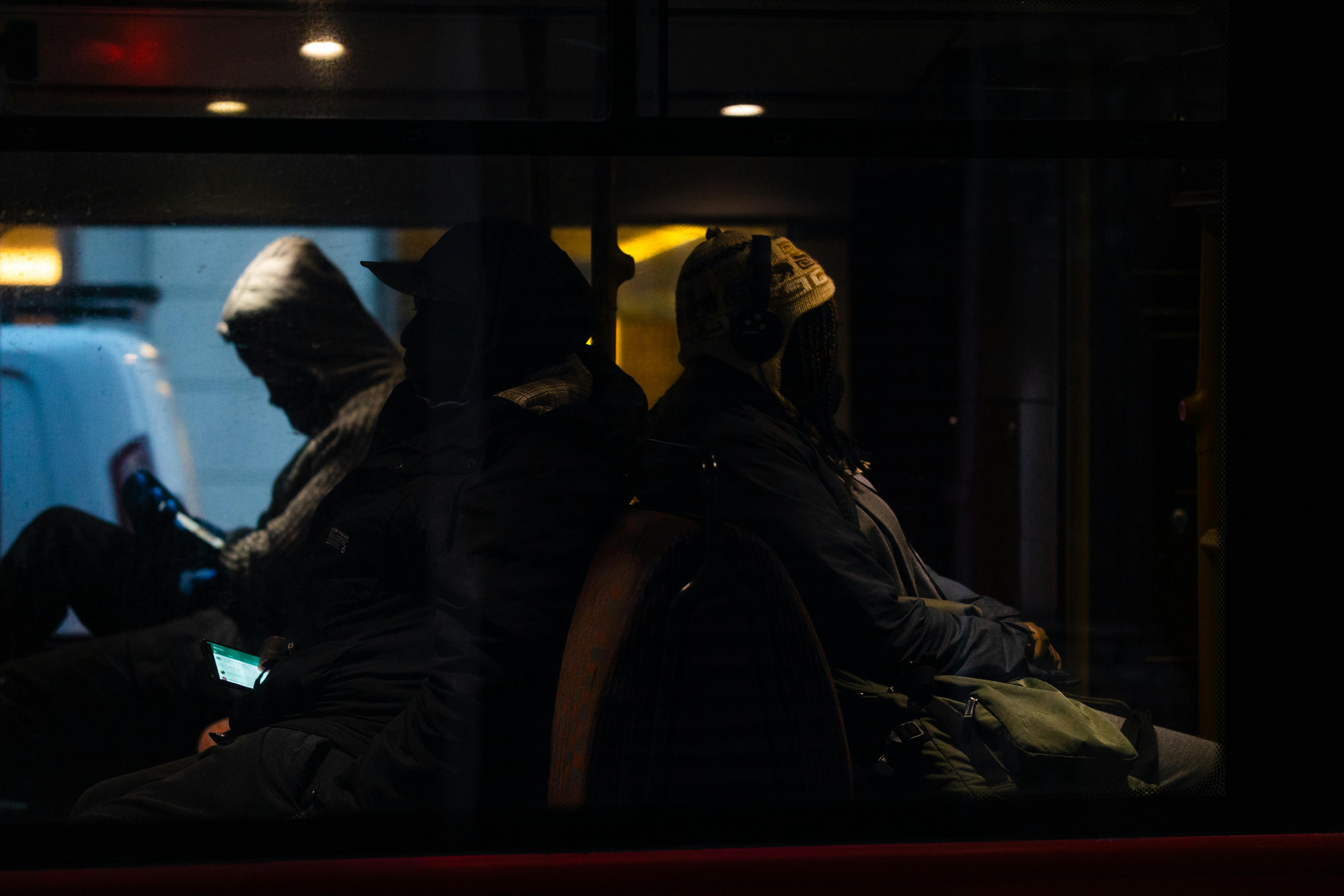 Back View of a Couple Sitting inside a Bus · Free Stock Photo