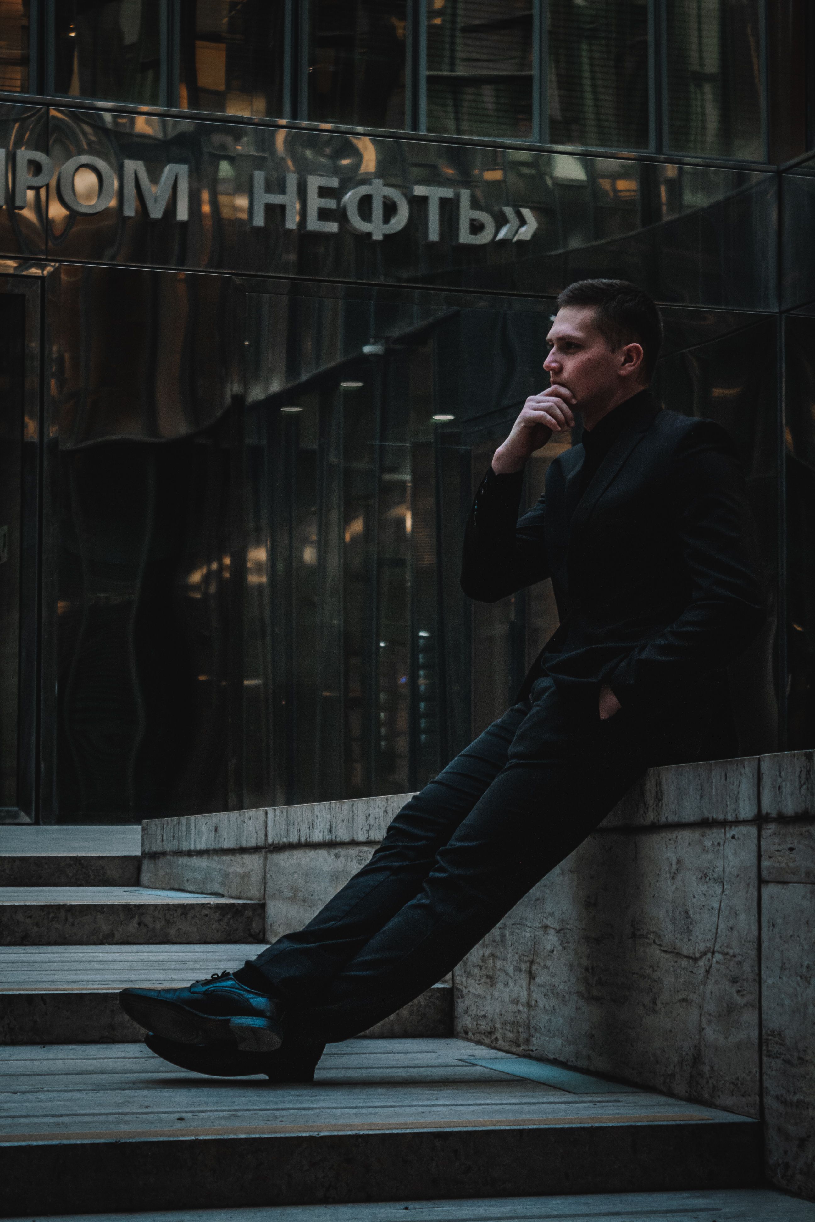 Man Waiting by Entrance to Office Buil · Free Stock Photo
