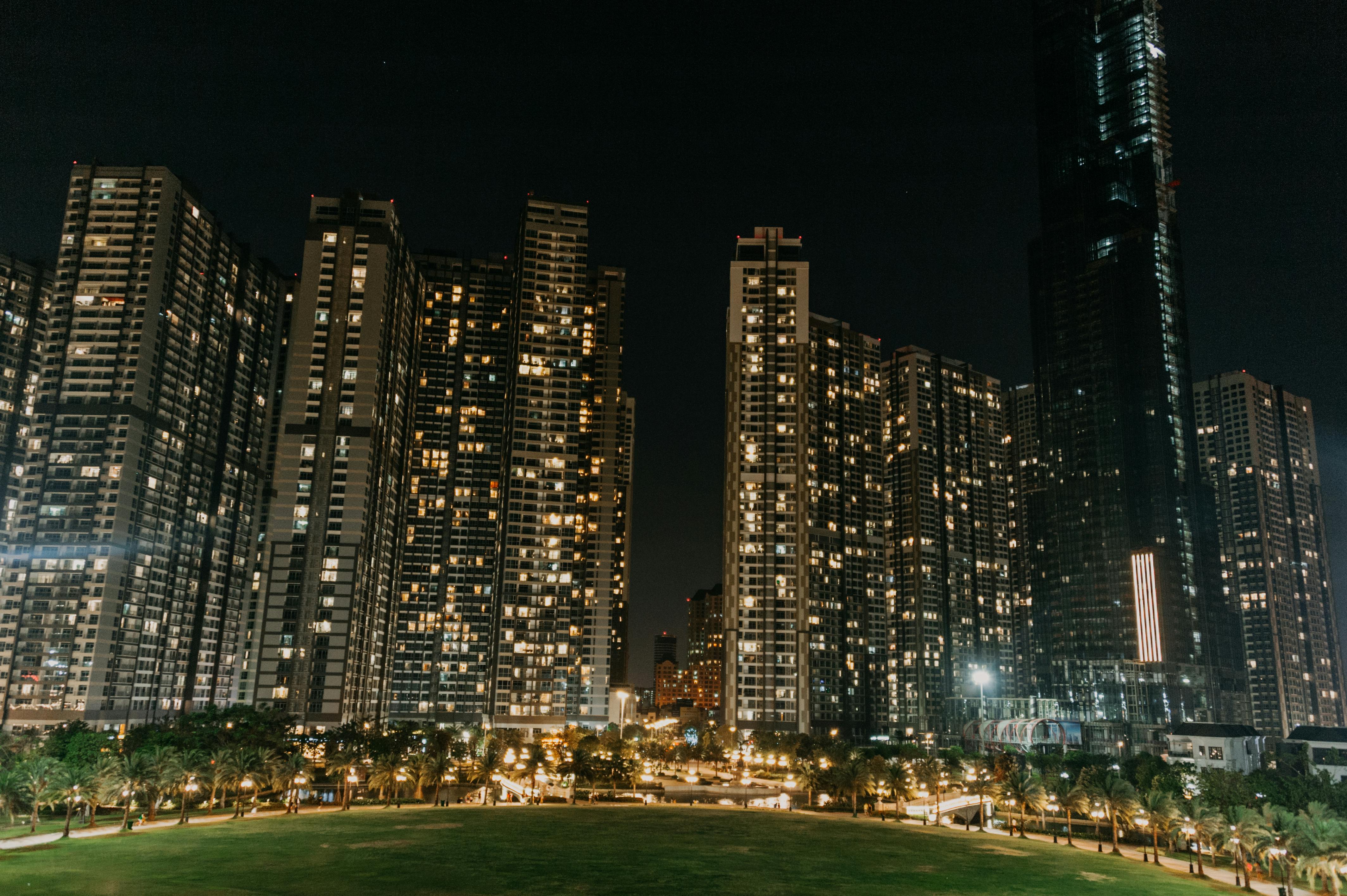 Lightened High Rise Buildings at Night Time · Free Stock Photo