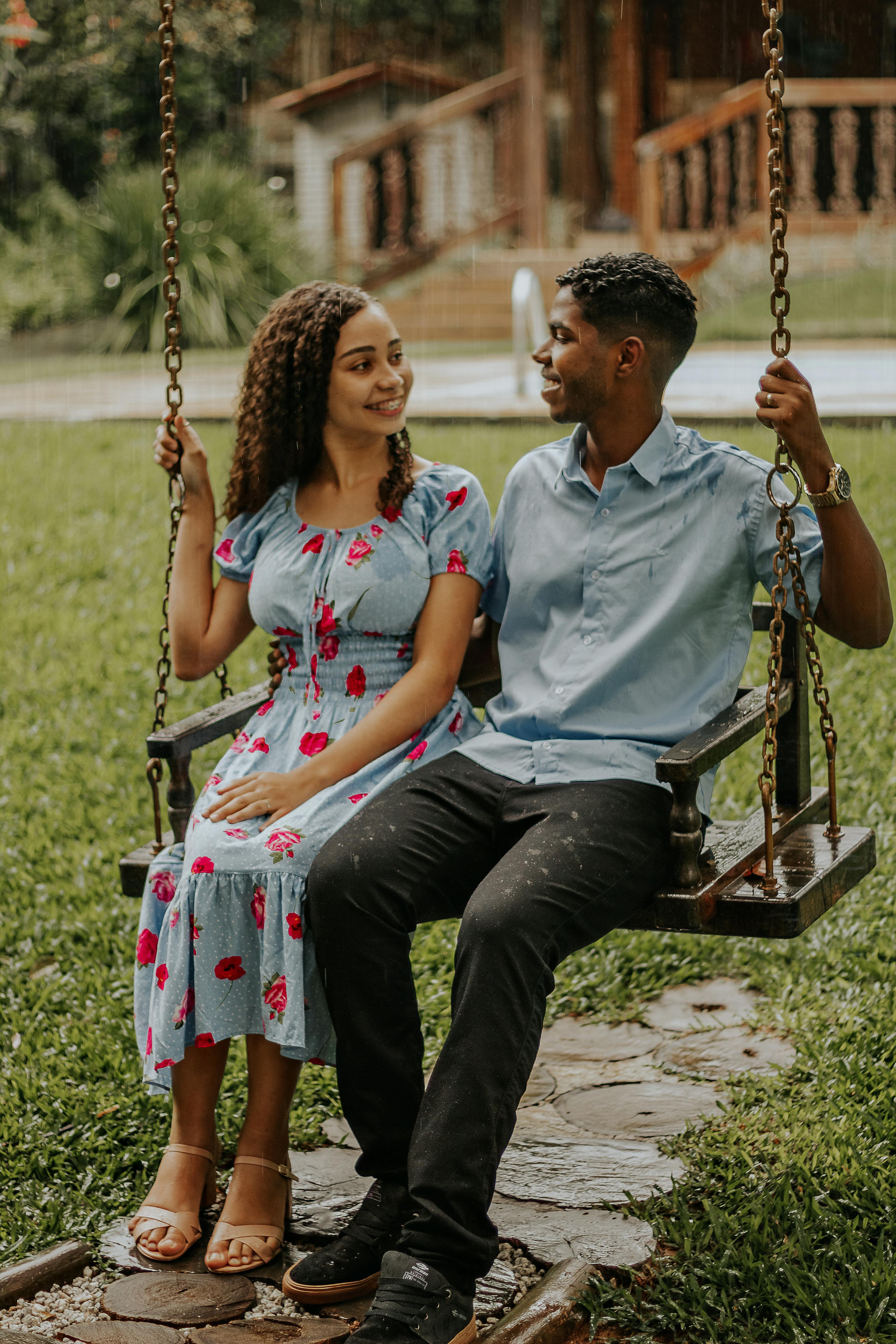Couple sitting on Swing · Free Stock Photo