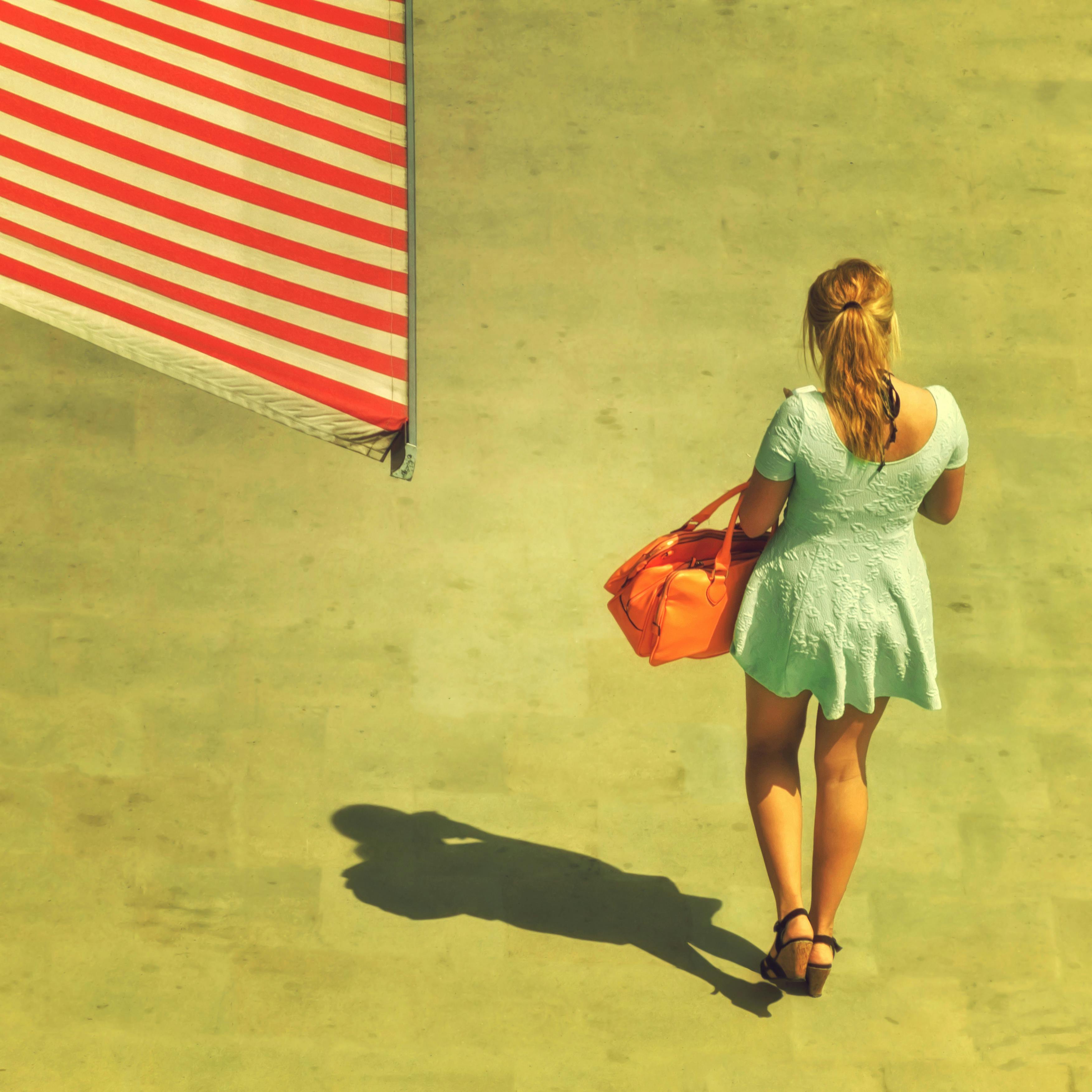Woman in Teal Dress Walking · Free Stock Photo